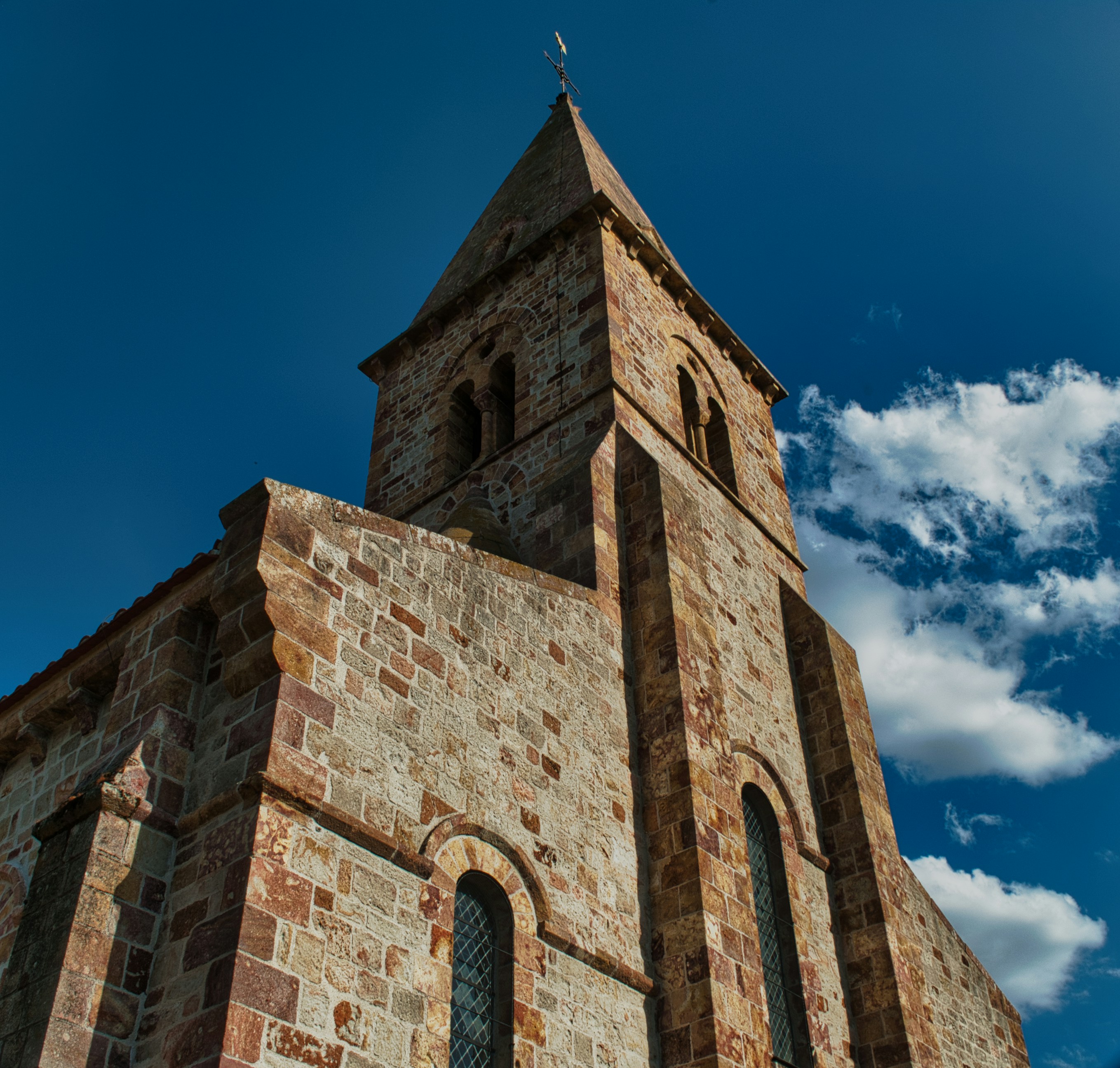 Stone Bell Tower Reaching Toward a Cerulean Sky