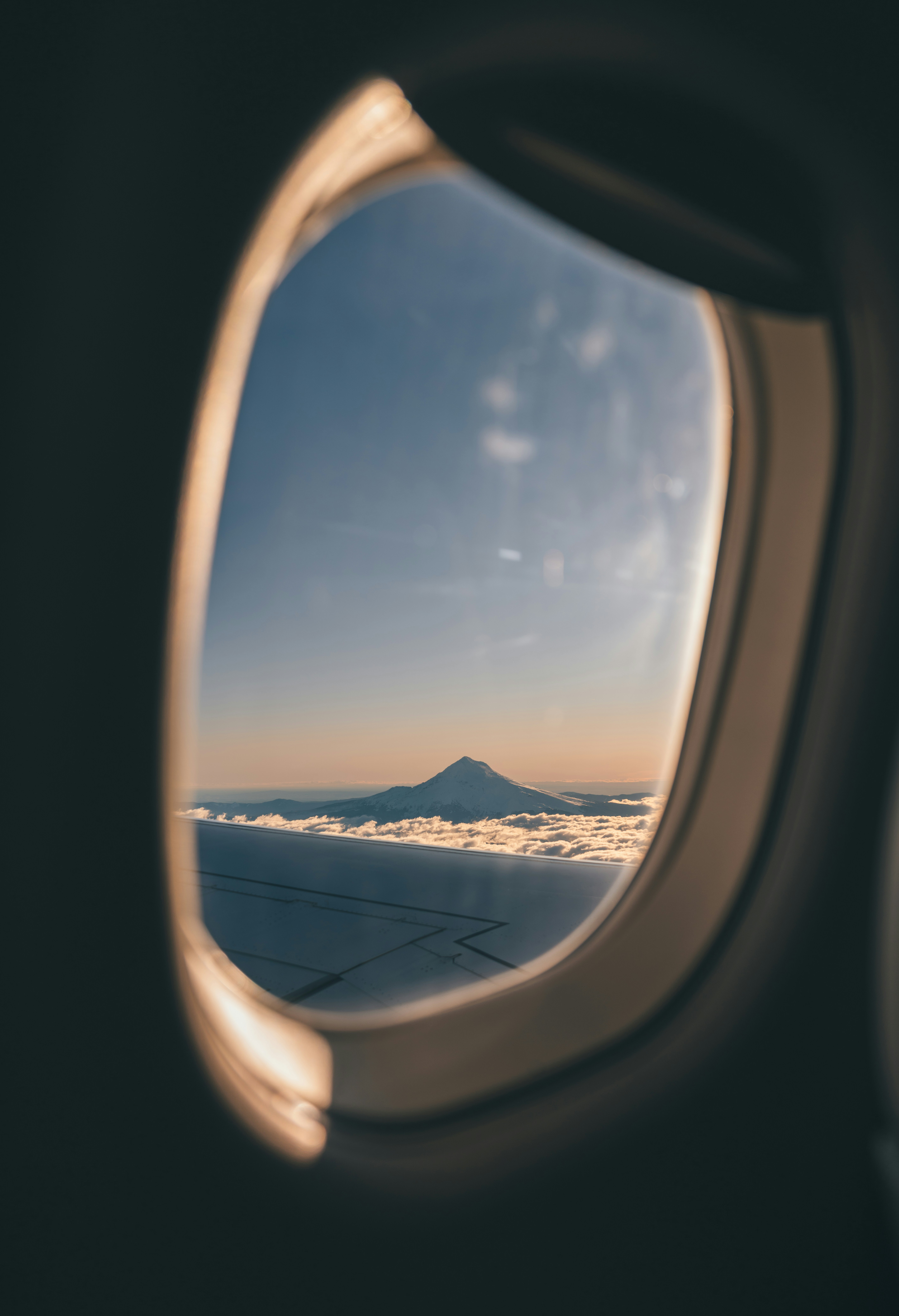 Above the Clouds: A Peak Framed by Windows