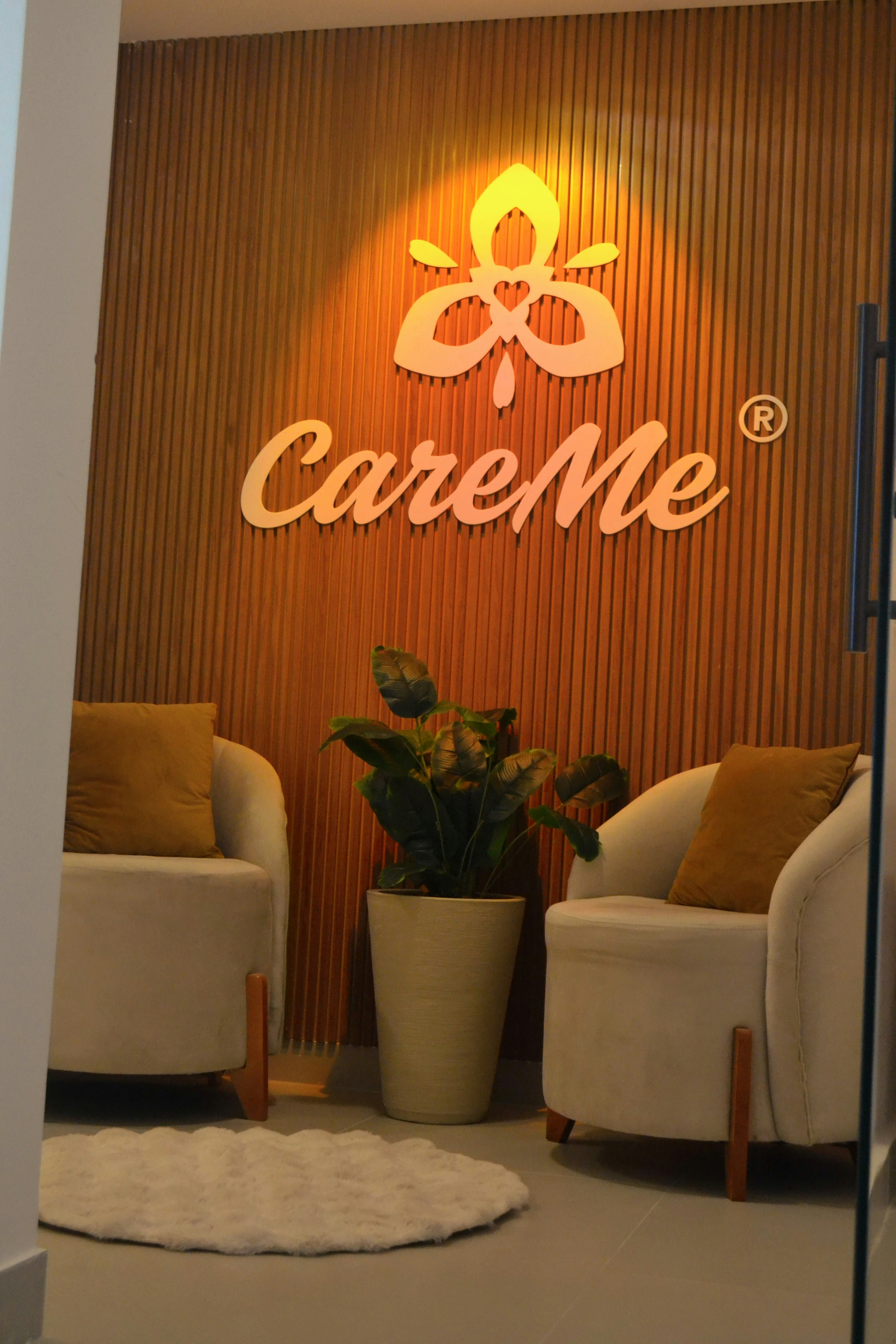 CareMe Lobby Portrait: Warm Welcome behind the Logo