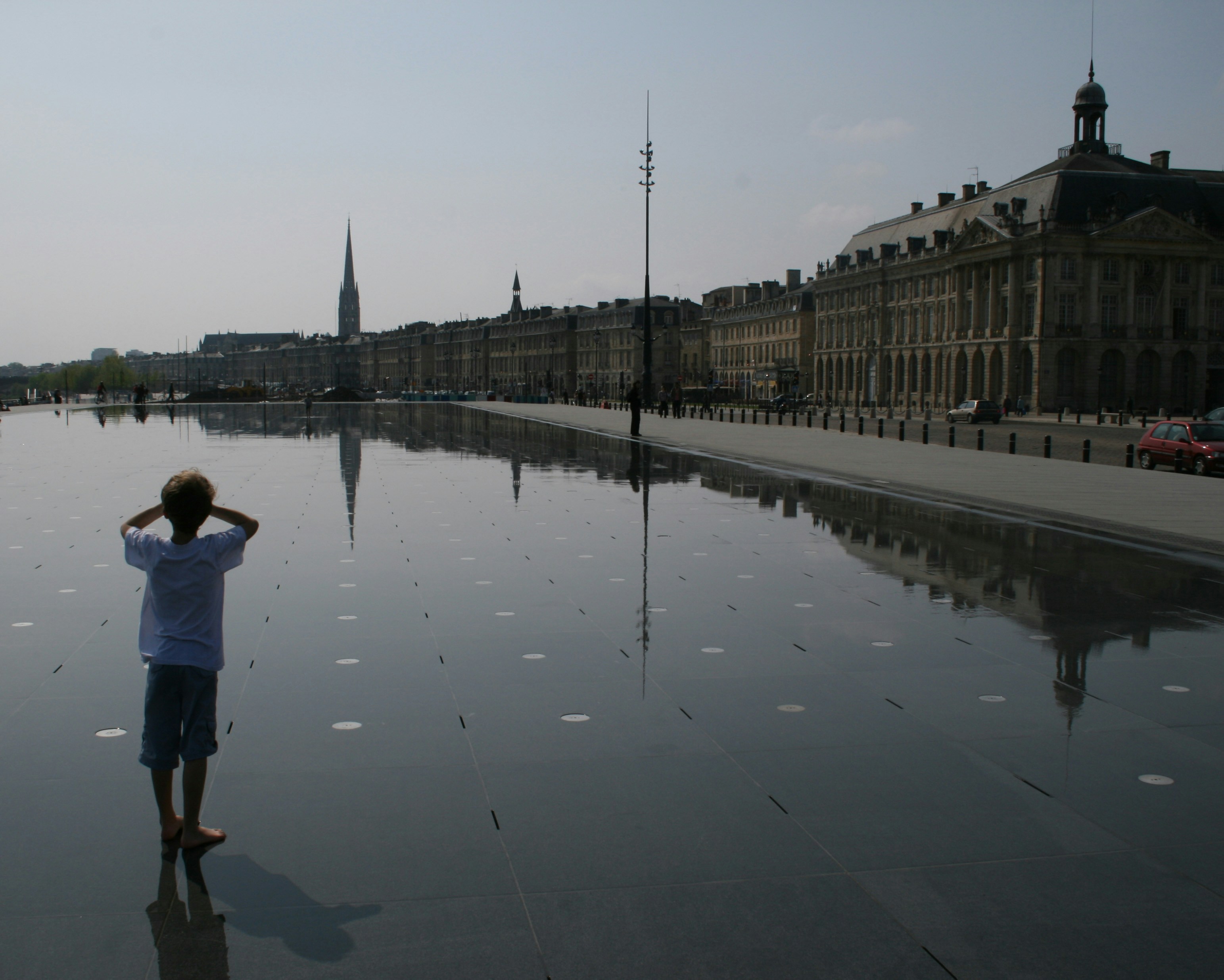 Reflection Fields: A Boy at the Edge of a City Pool