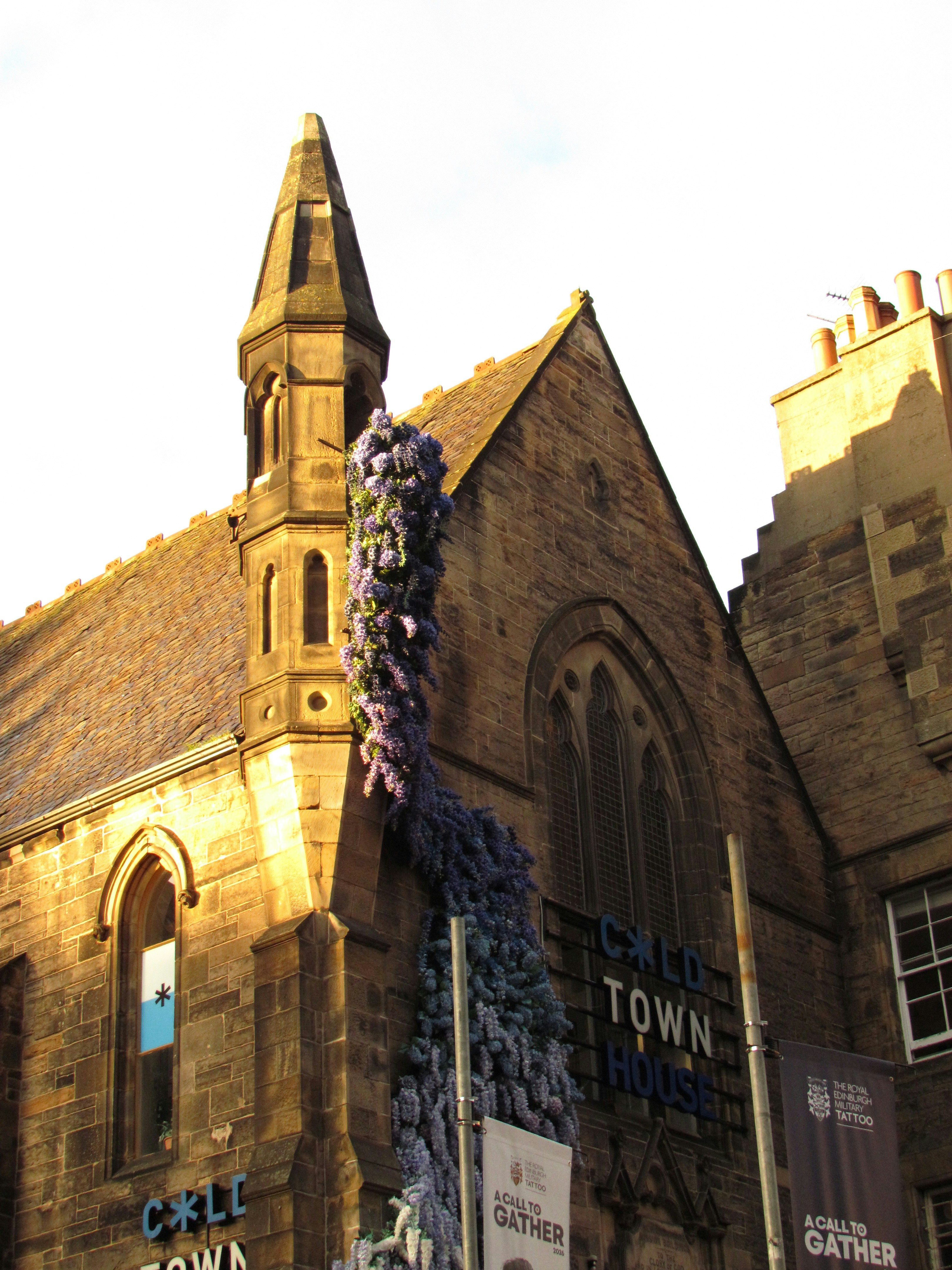 Gothic Facade and Cascading Blooms on a Historic Town House