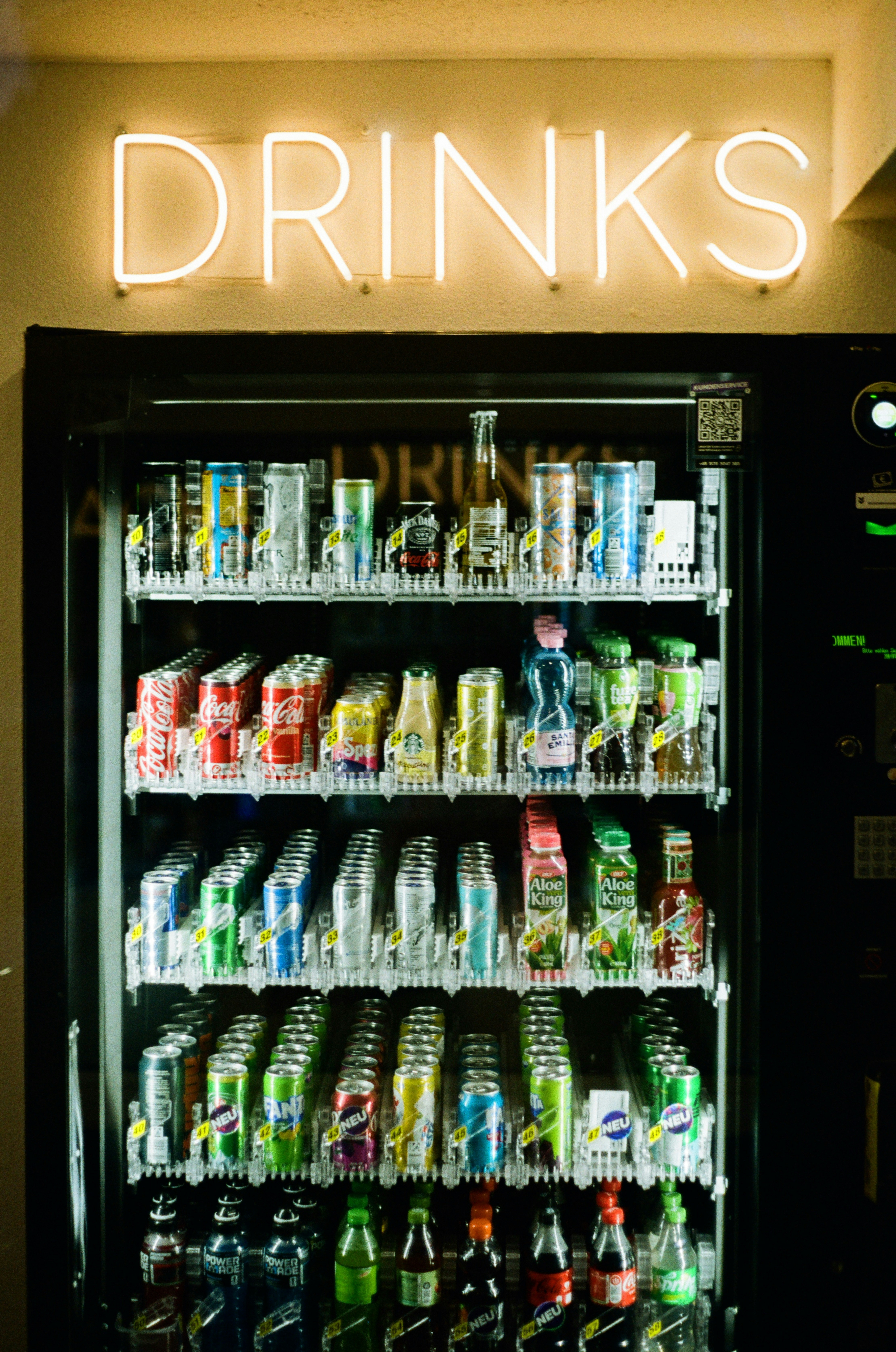 Neon-Illuminated Drinks: A Vivid Vertical Preserve