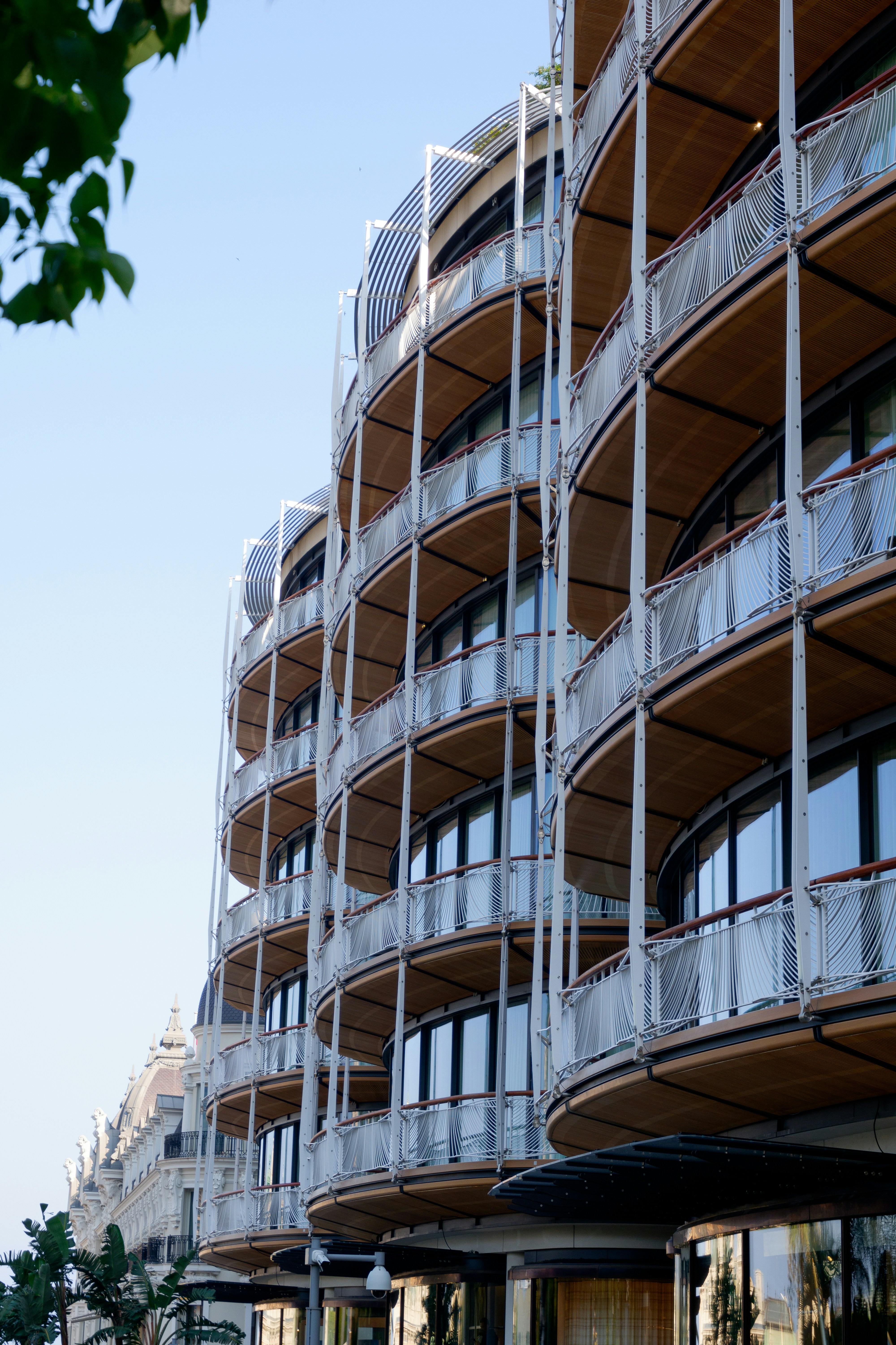 Curved Facades in Repetition: A Vertical Dance of Balconies