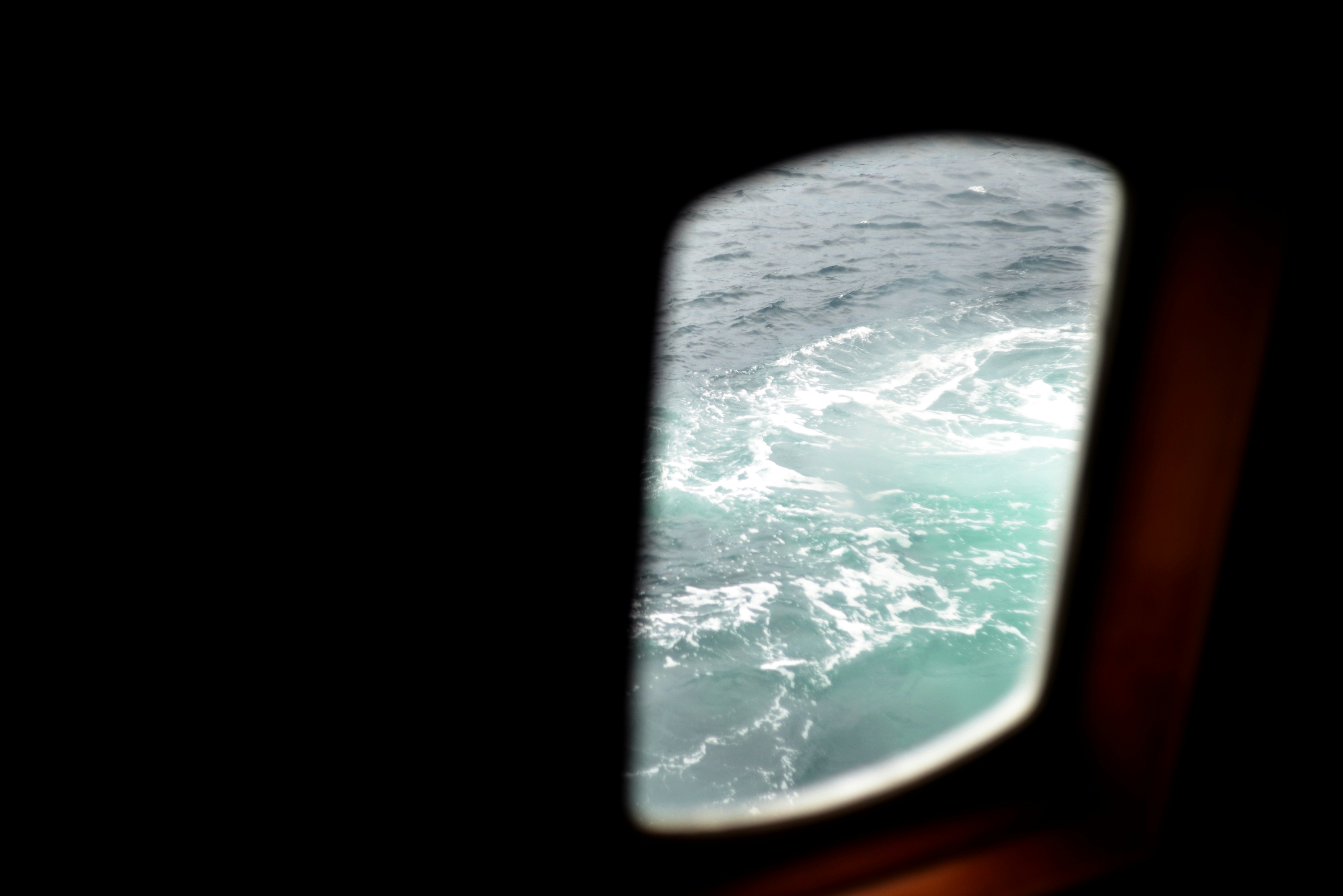 Seafoam Beyond the Window: A Quiet Moment Aloft