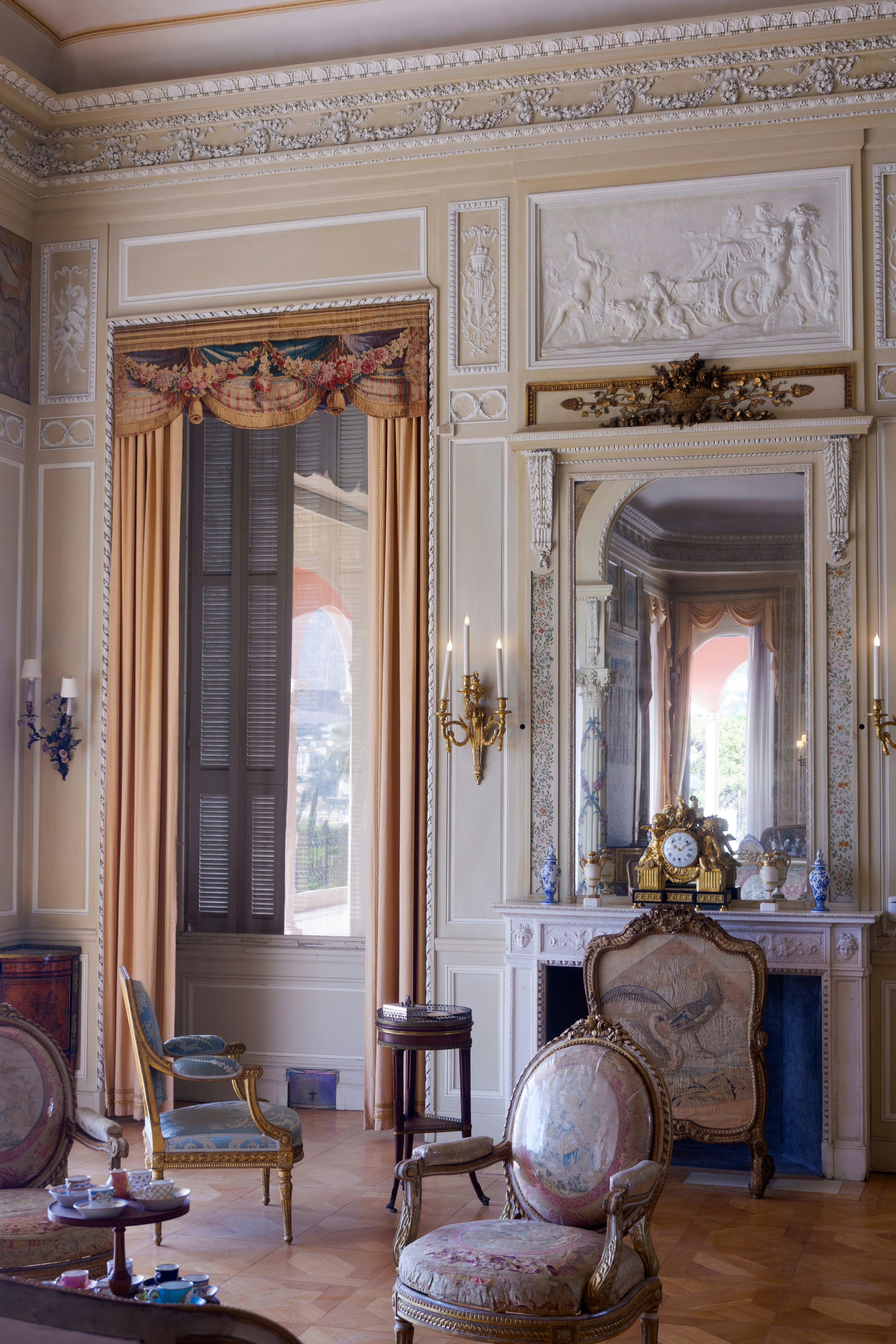 Heritage Salon: A gilded living room with antique furnishings and a moonlit mirror