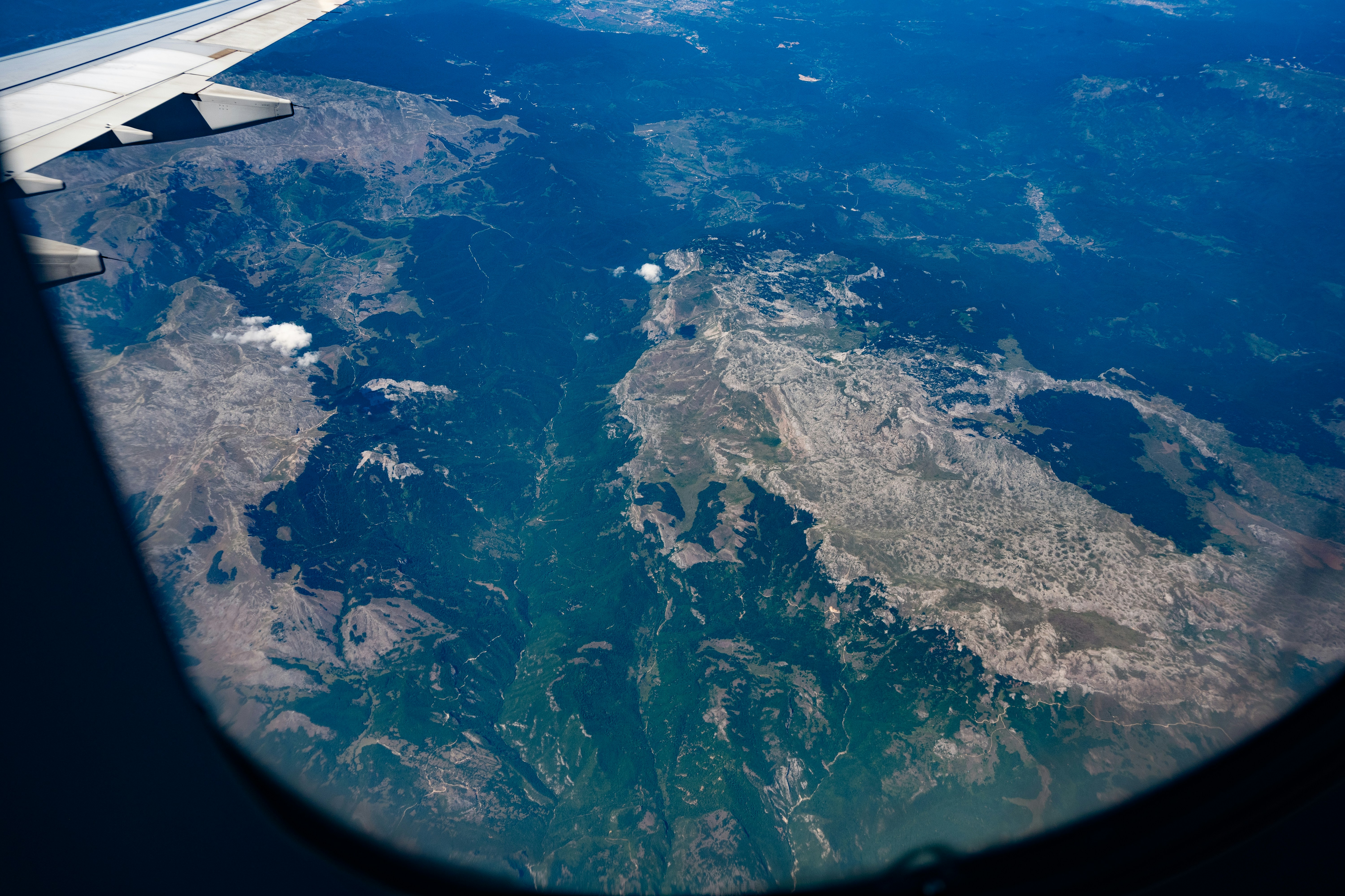 Blue Horizons Through a Plane Window