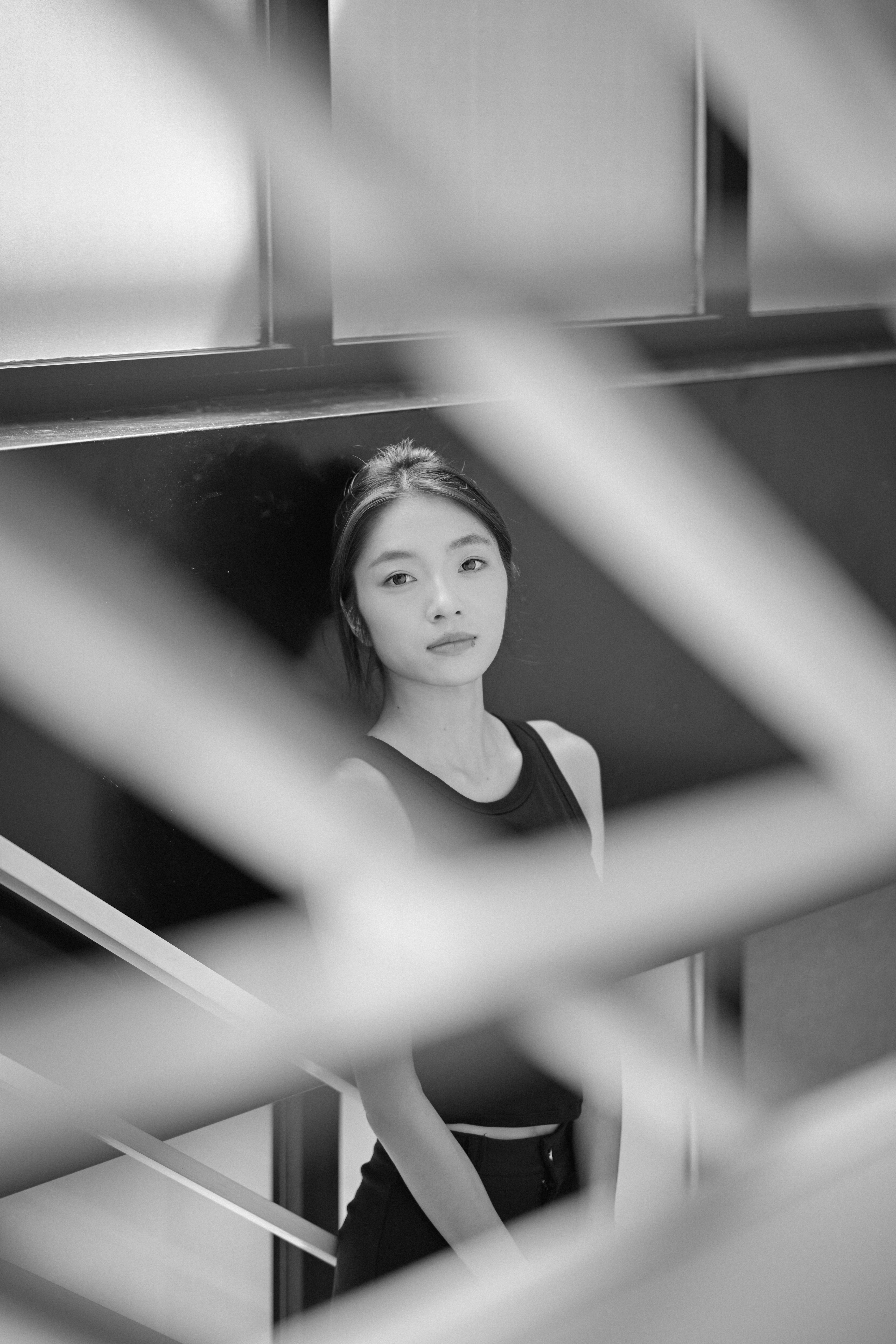 Facing the Frame: Quiet Confidence Behind the Lattice