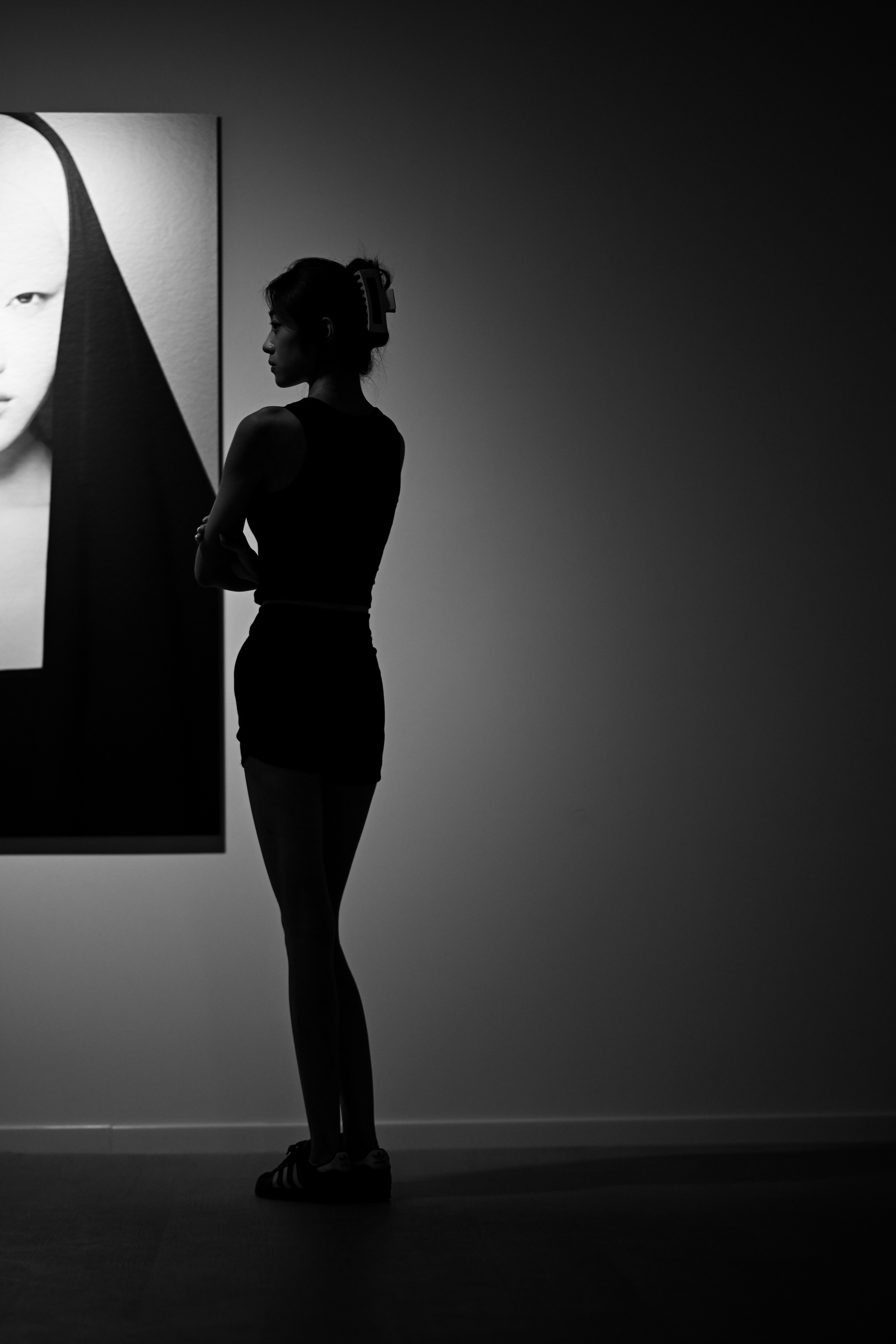 Silent Contemplation: A Portrait of Shadow and Shape in an Art Gallery