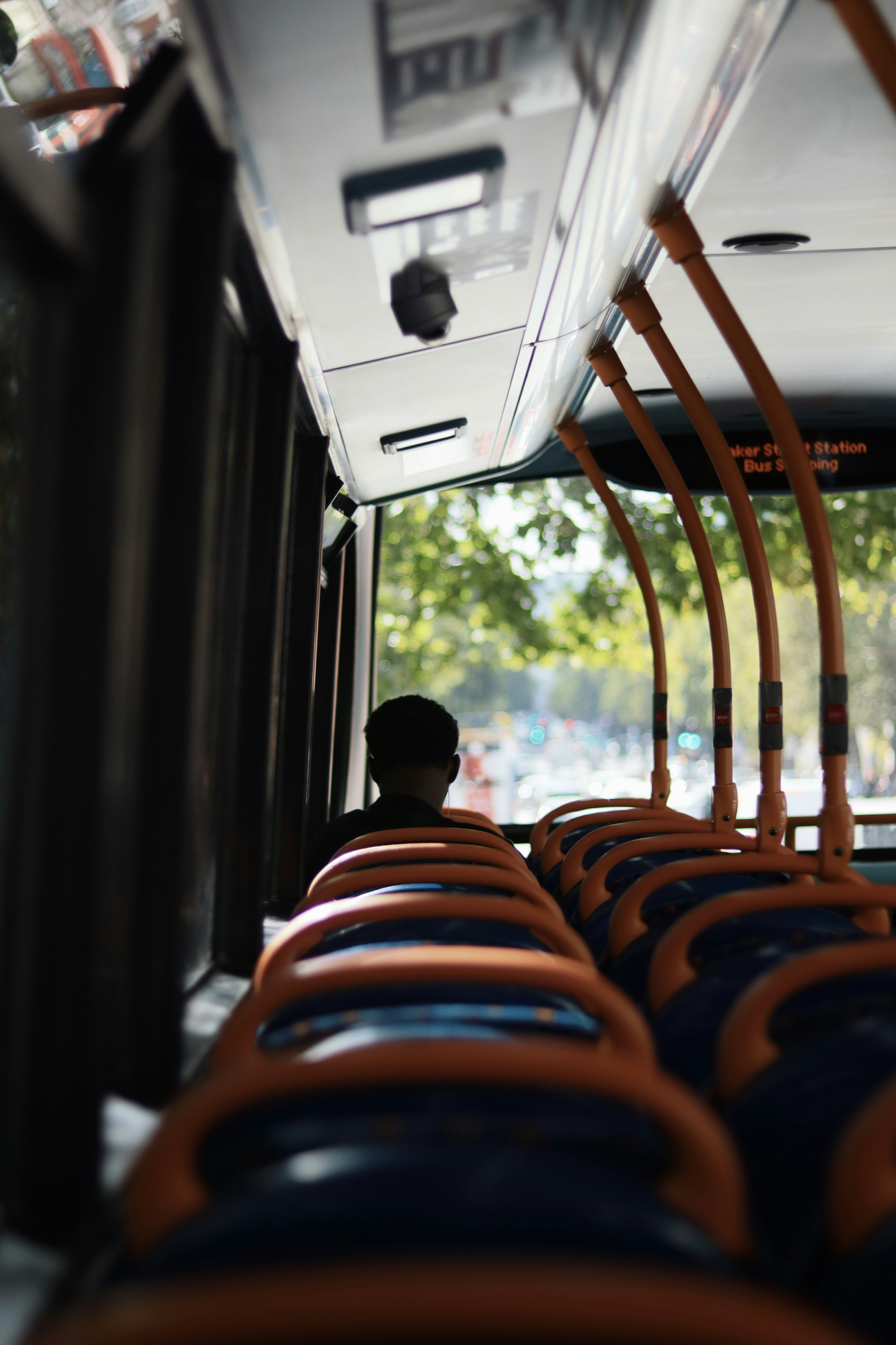 Backseat Horizon: Orange Handrails Lead the Way