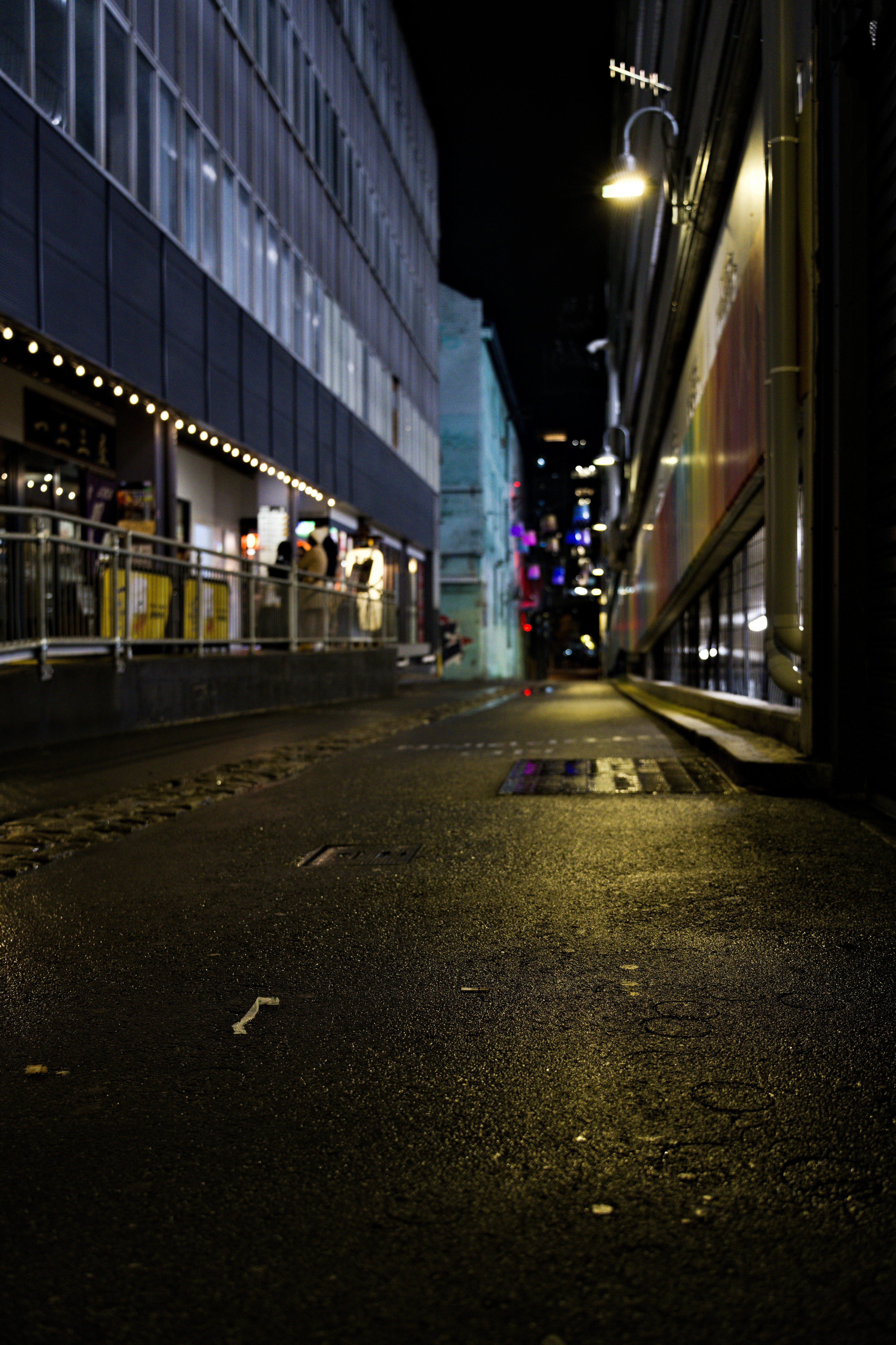 Night Street Corridor: Neon Glow by the Quiet Shopfronts