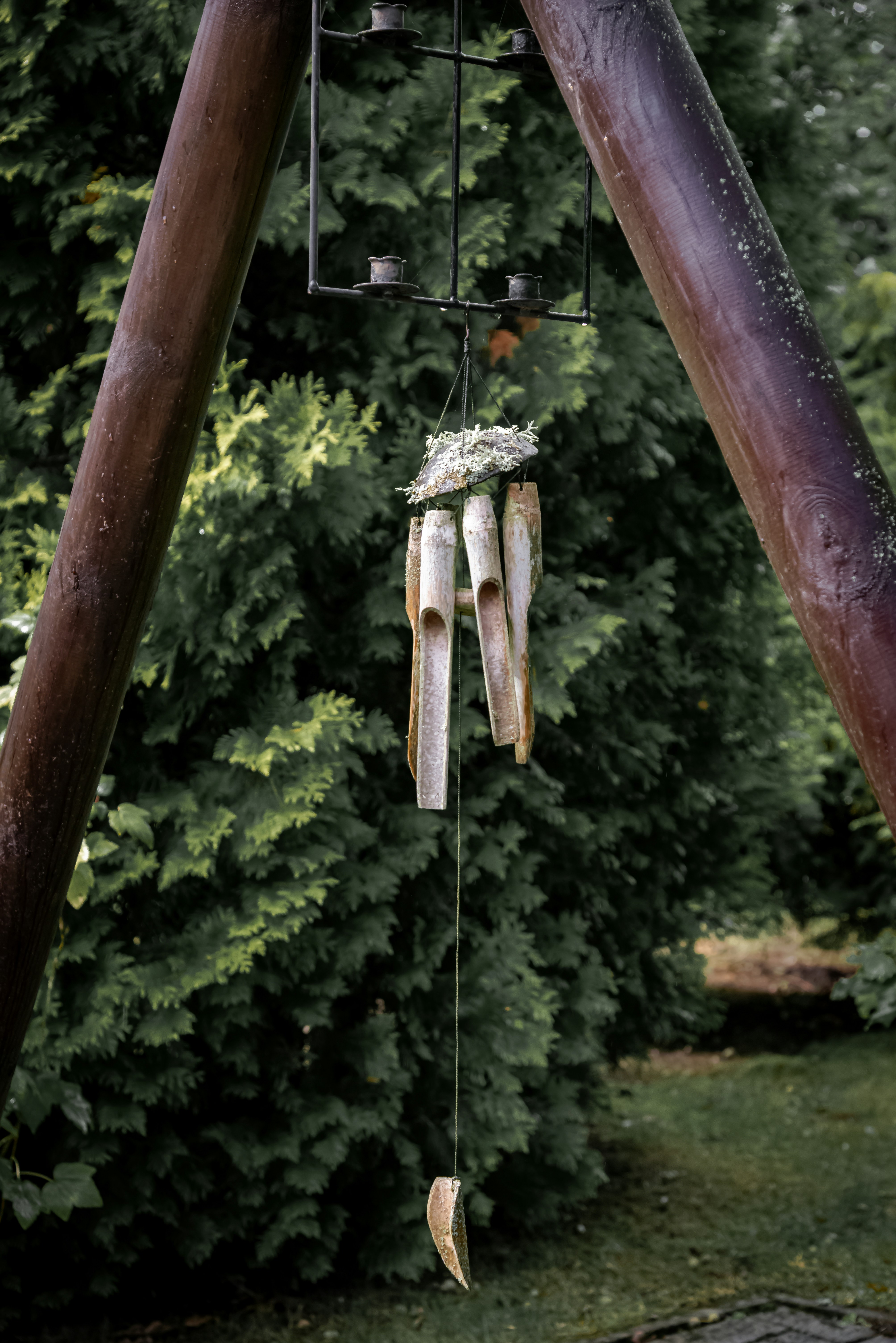 Hanging Wind-Scape: A Weathered Chime Dangles from A Rustic Frame