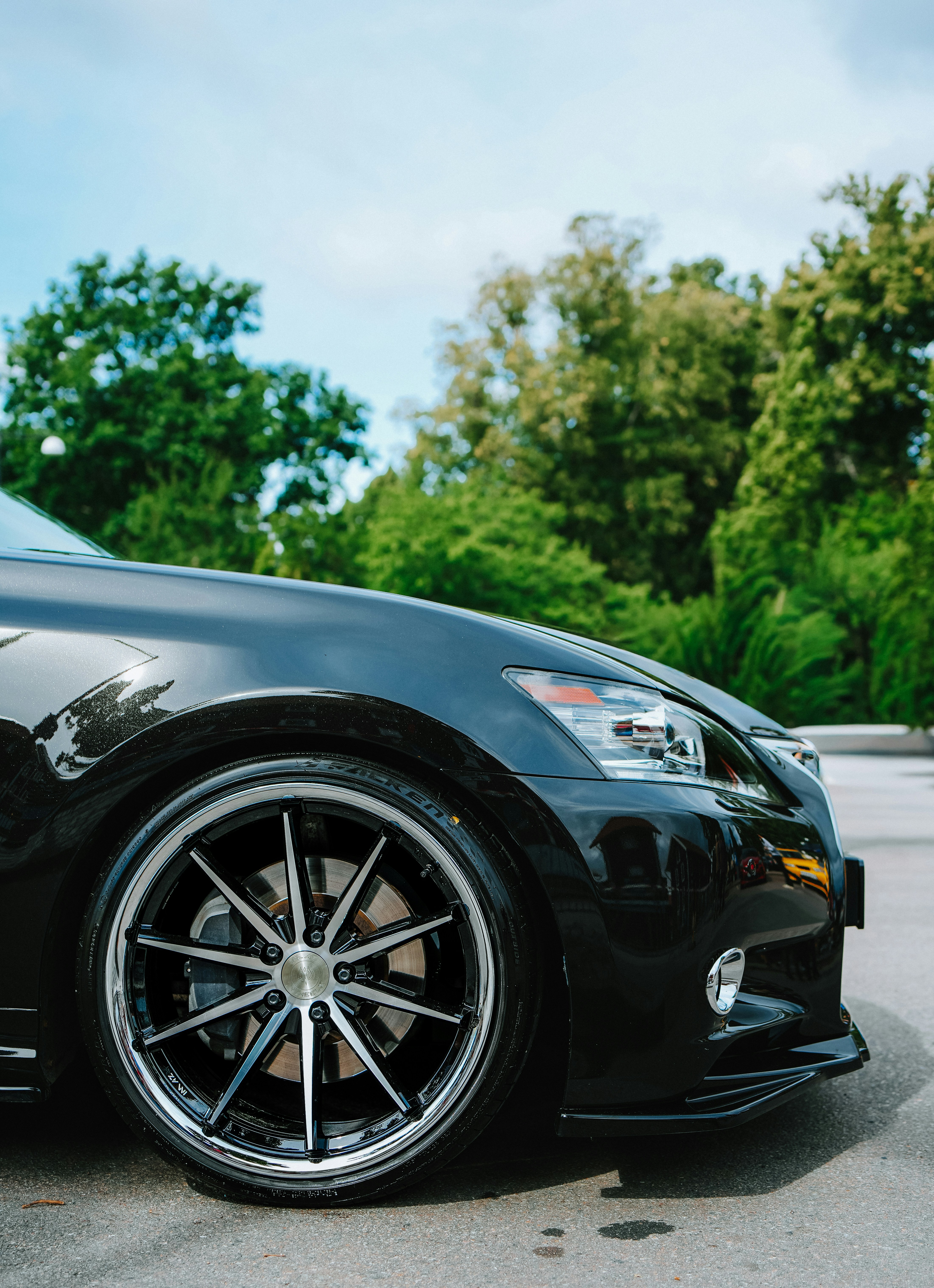 Low-Slung Noir: A Glimpse of the Front Wheel and Curve of the Black Precision