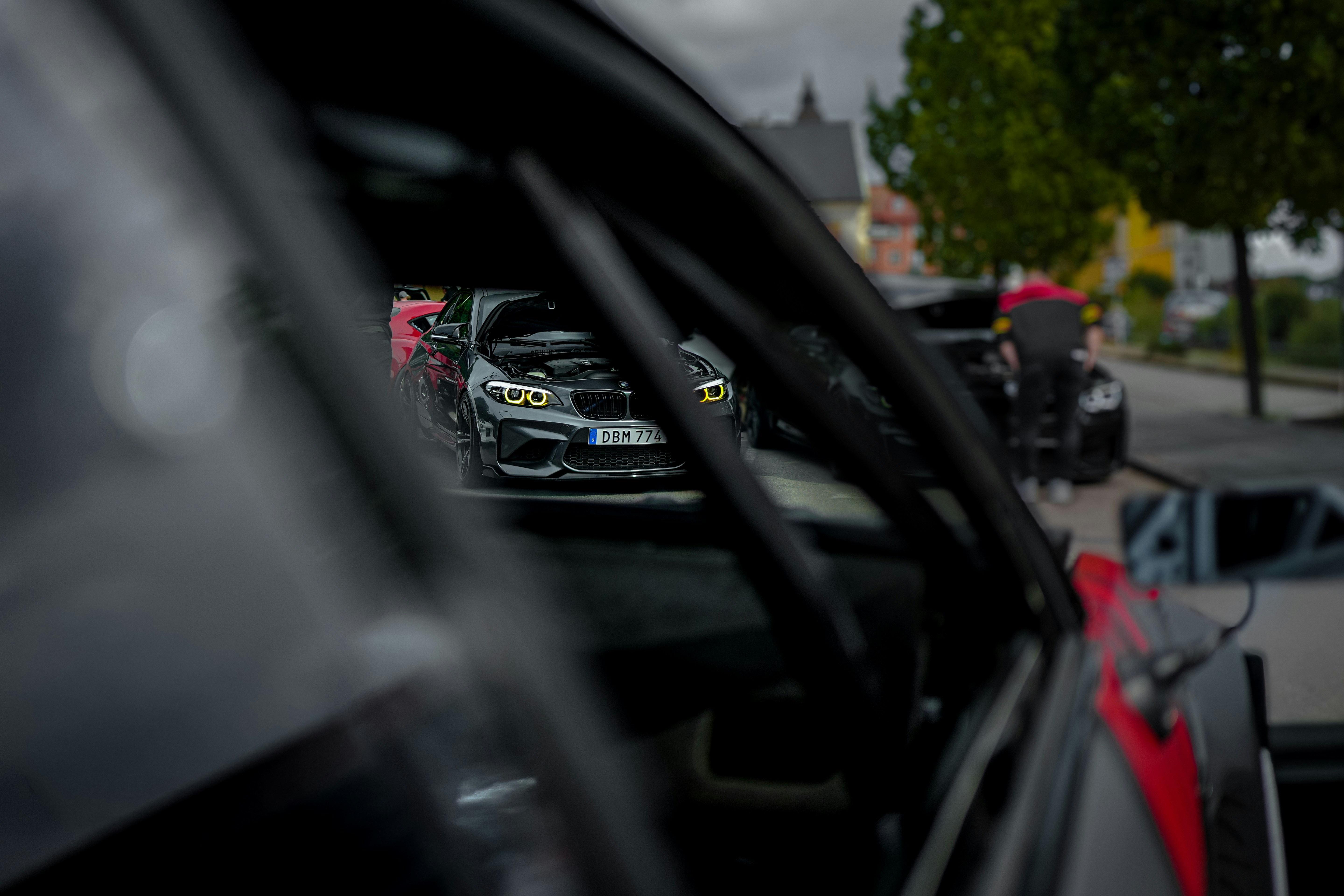 Mid-Frame Reveal: A Rally of Reflections Through the Car Window