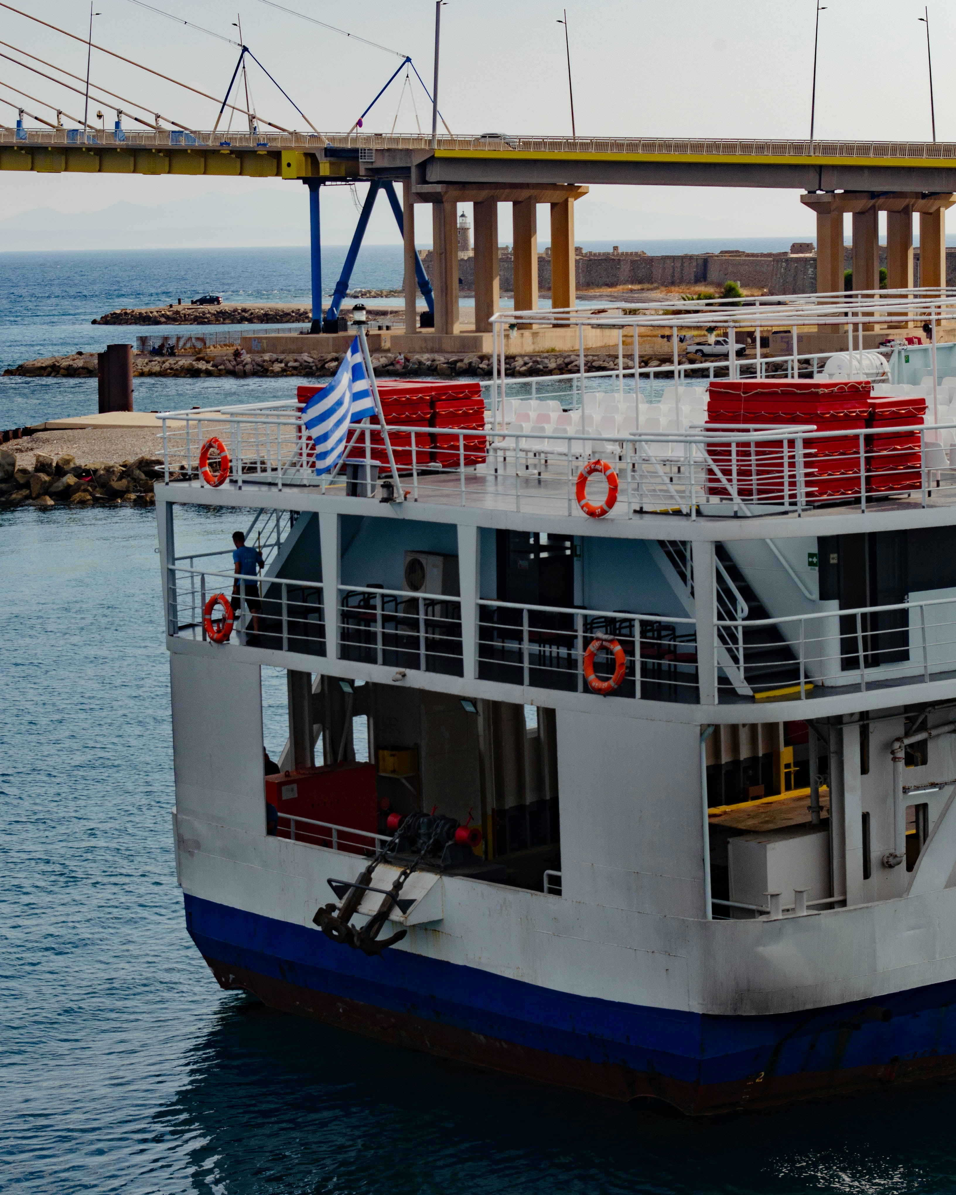 Maritime Gallery: A Decked Vessel Near a Coastal Break