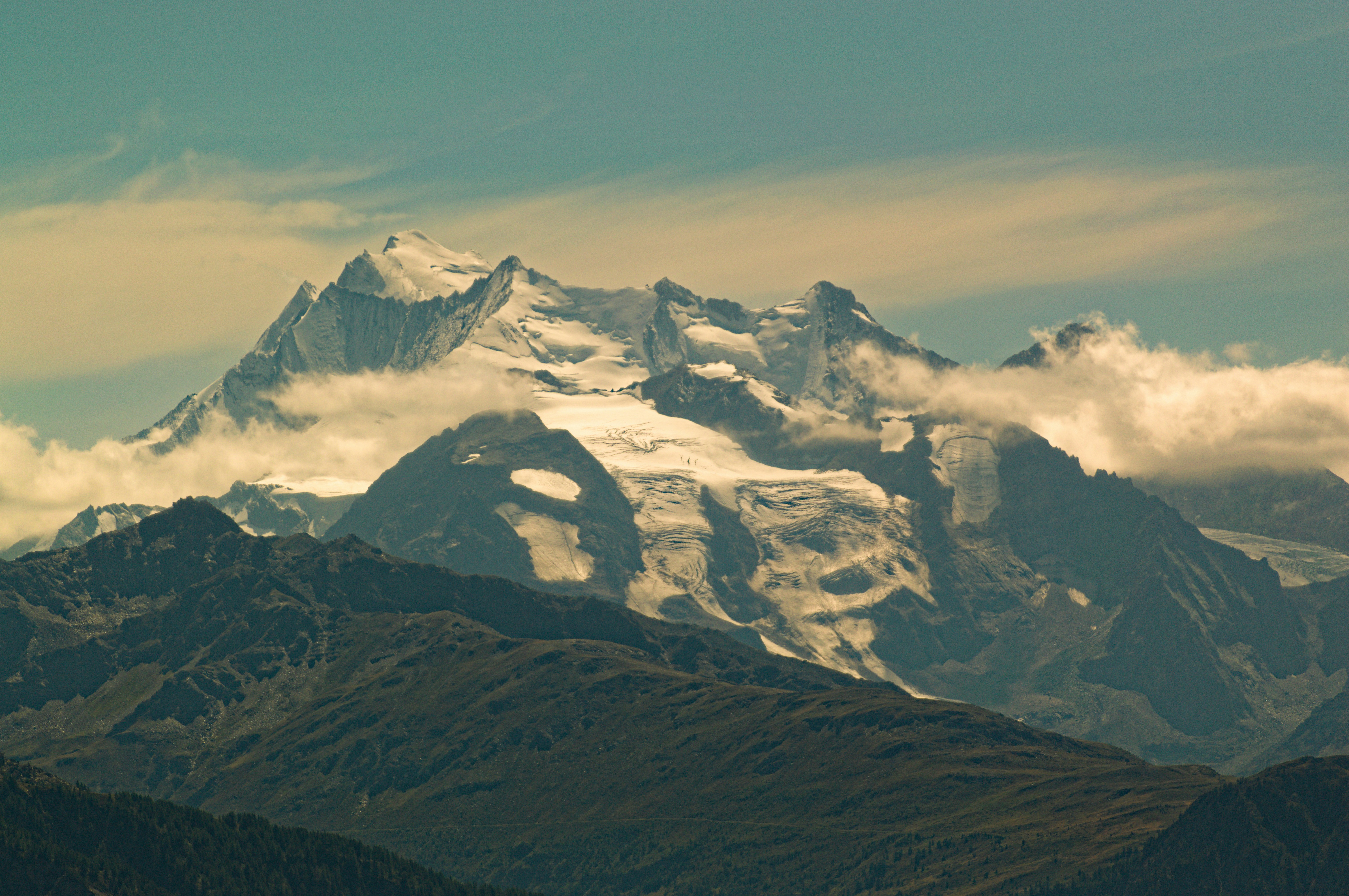 Snowbound Peaks under a Quiet Golden Sky