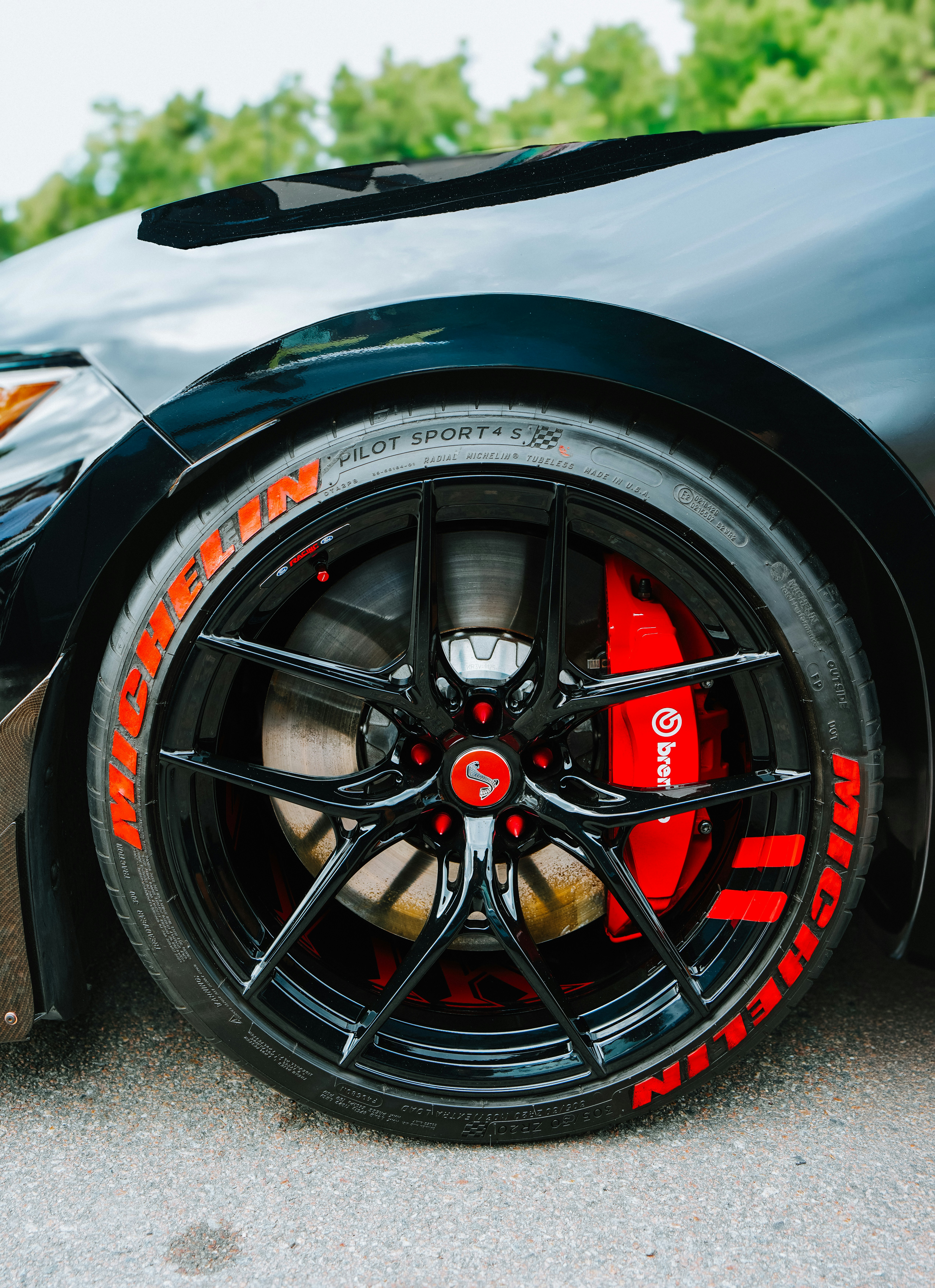Red Fury: Close-Up of a Ferrari Brake and Wheel