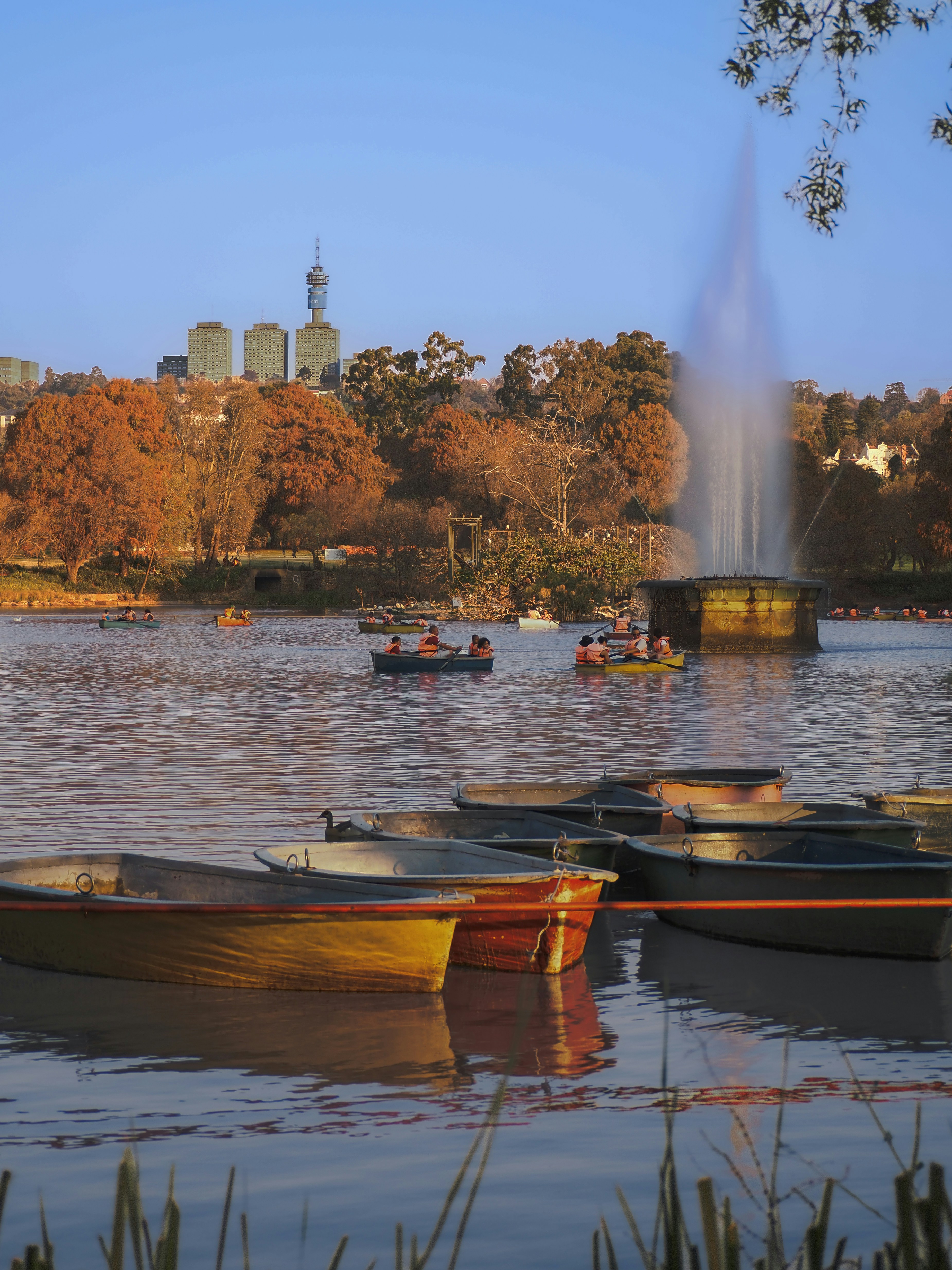 Boats at Rest Circling a Fountain under Autumn Skies