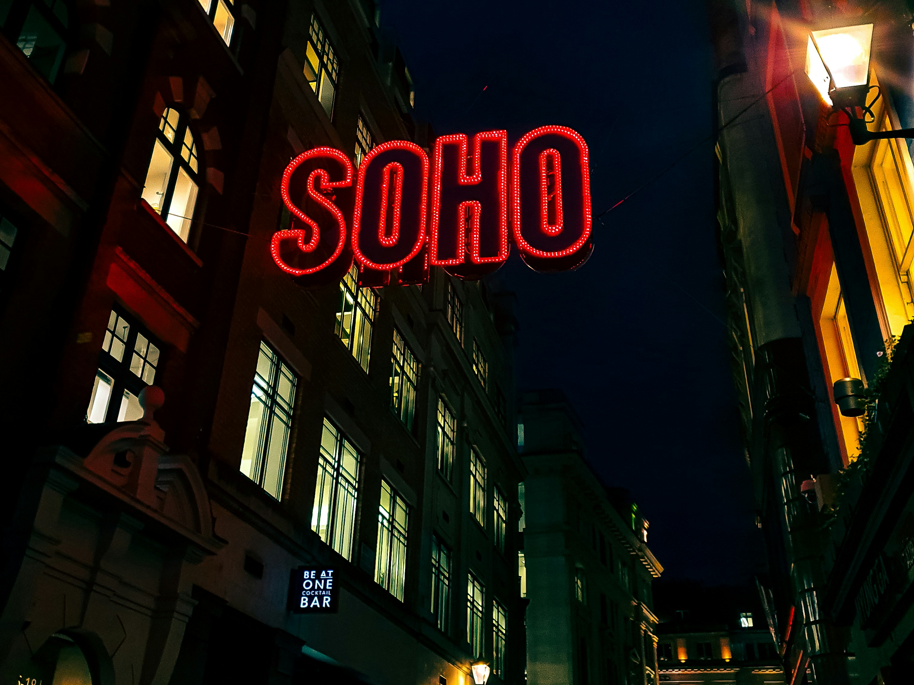 Neon SoHo Aglow: Night Facade of a City Street