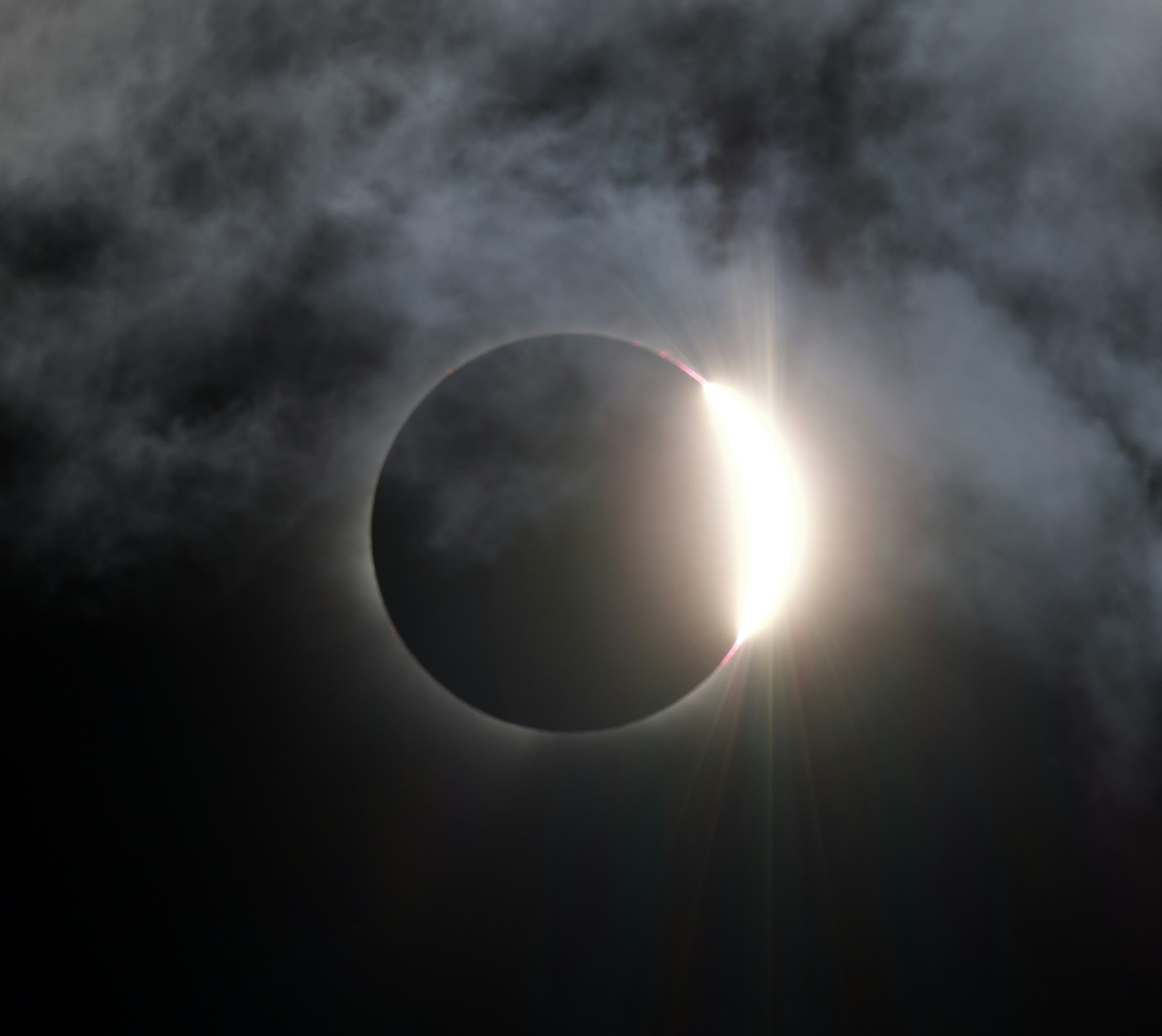 Crescent Solar Eclipse Piercing the Veil of Night
