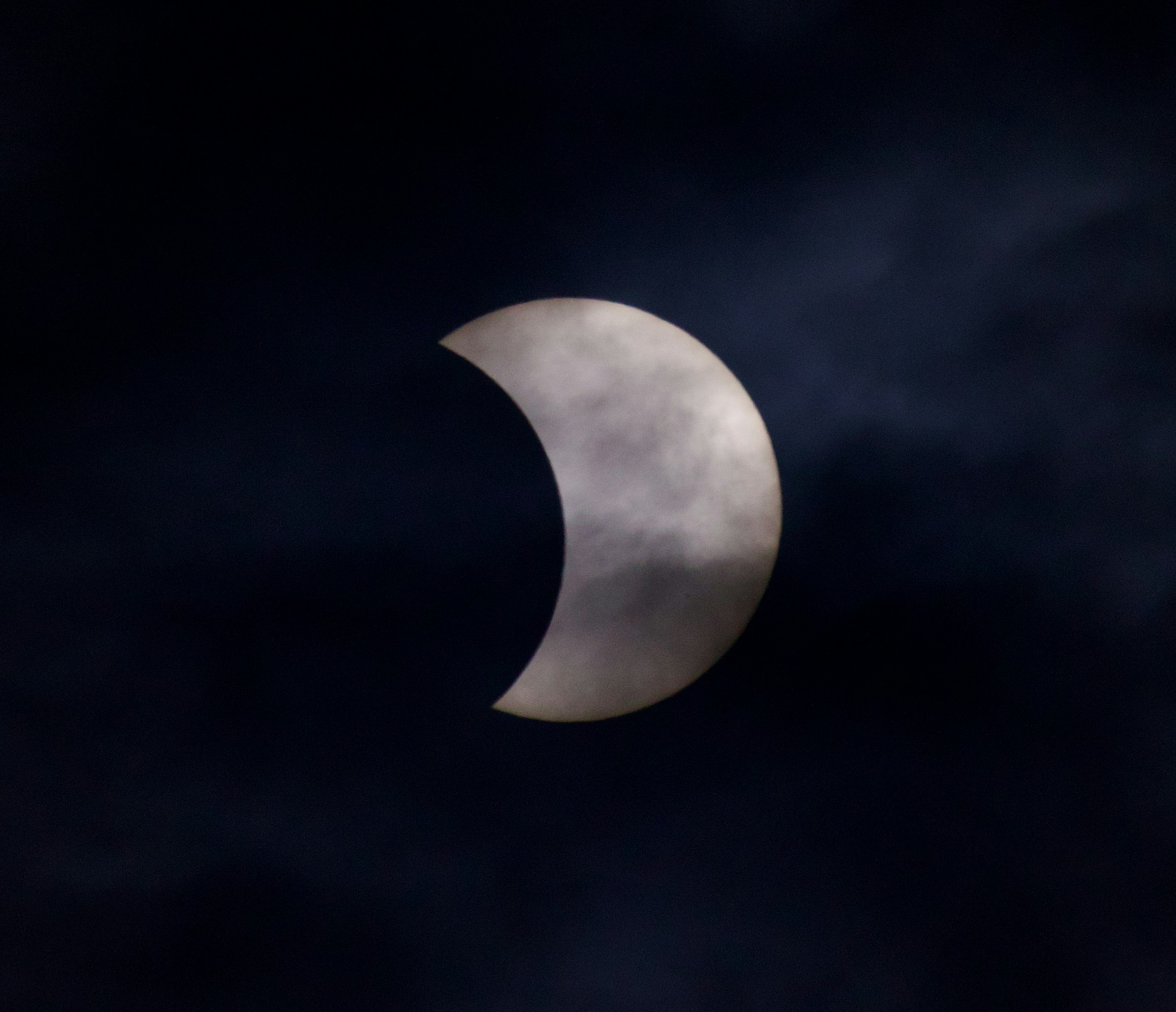 Partial Eclipse Crescent: Moon Reveals a Quiet Silhouette
