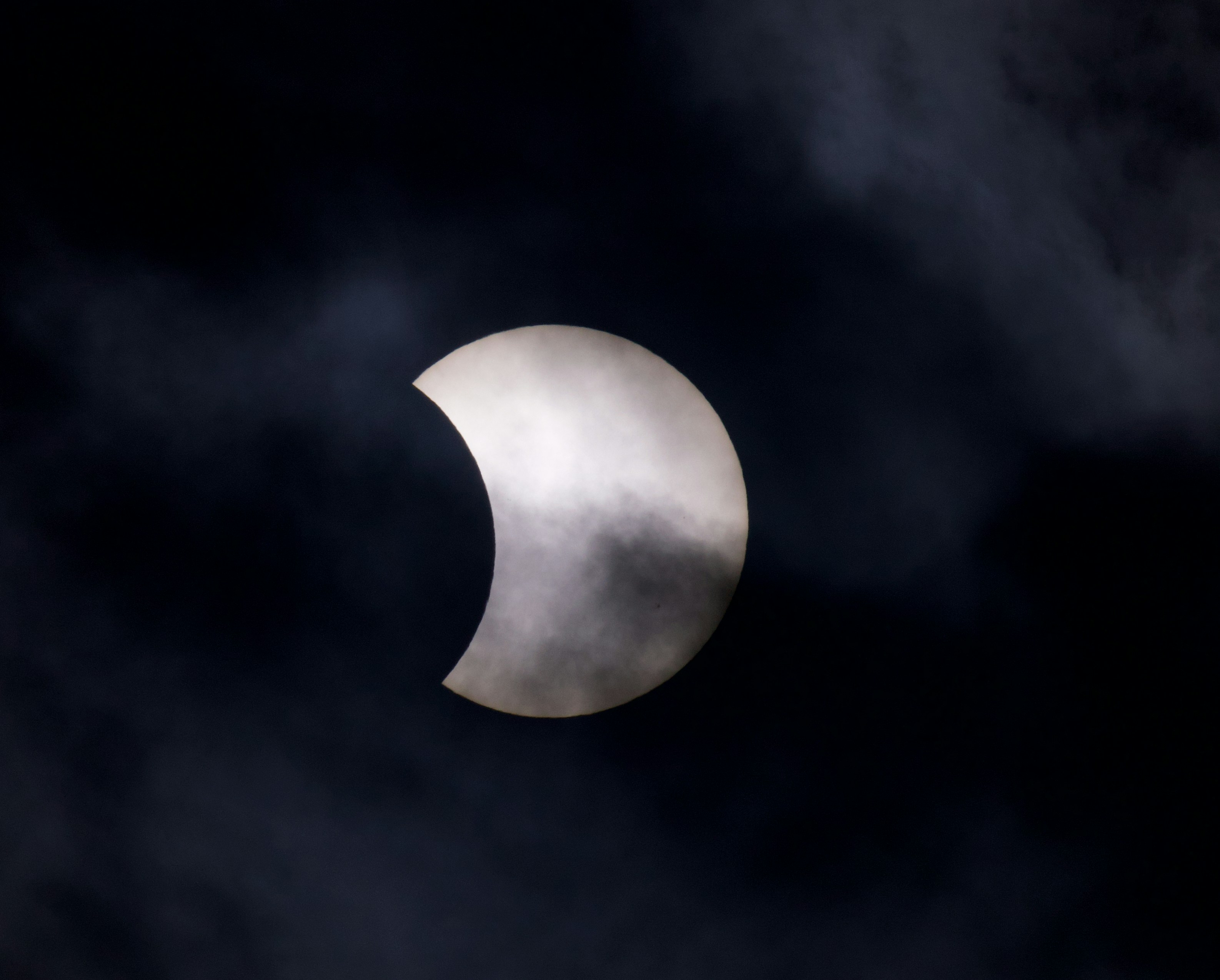 Partial Solar Eclipse in Quiet Night Skies