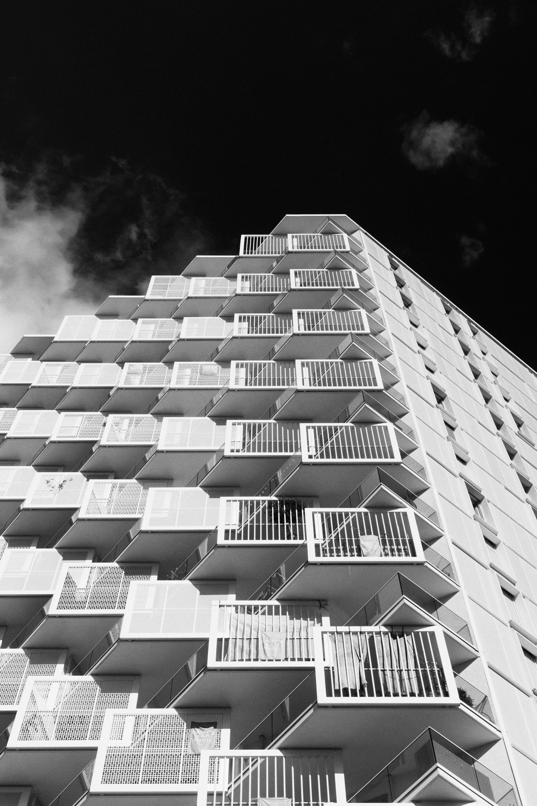 Vertical Symphony: A Diagonal Facade of Repeating Balconies