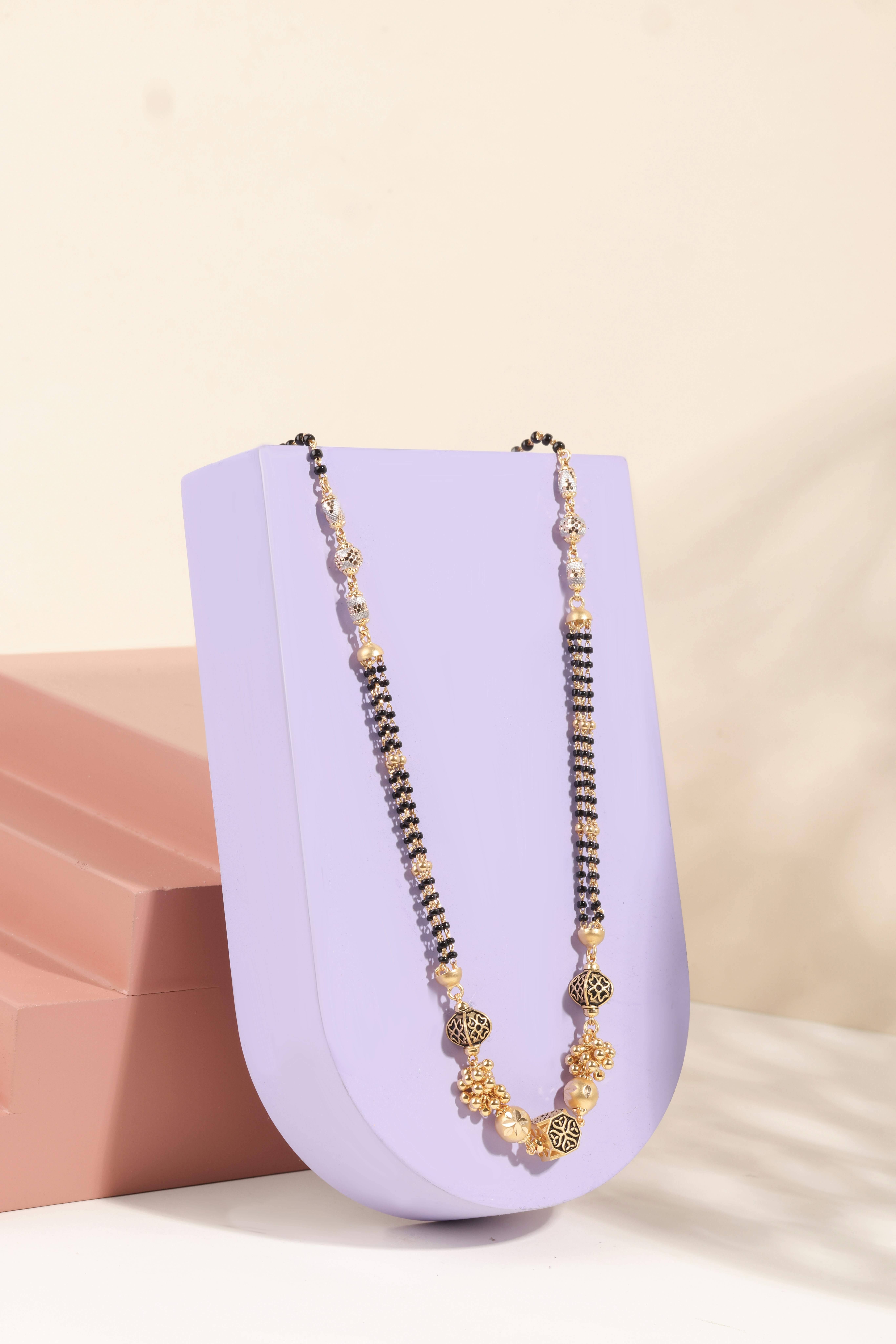 Sugar-Silk Necklace Draped over a Lavender Display
