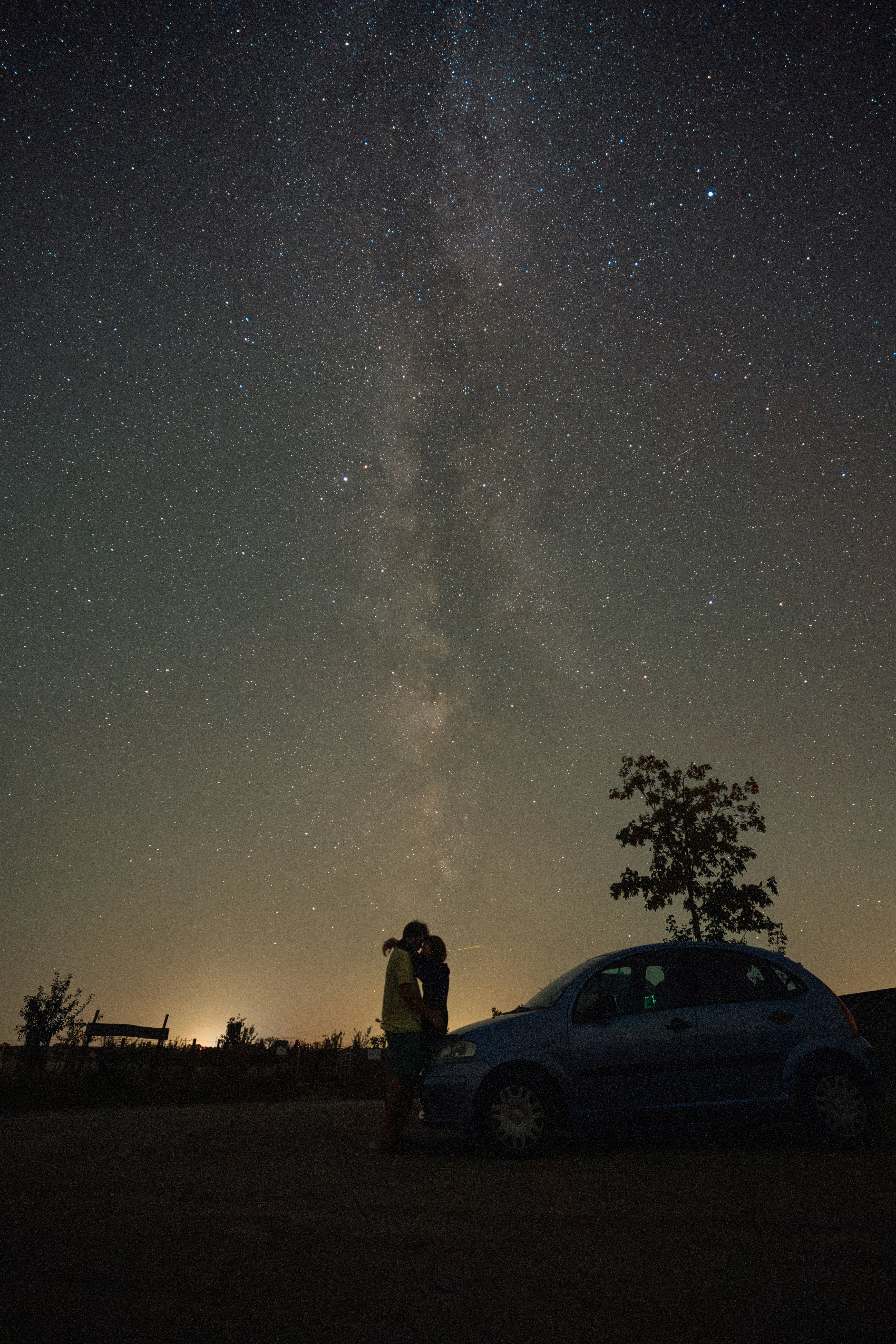 Midnight Milky Way Embrace by the Car
