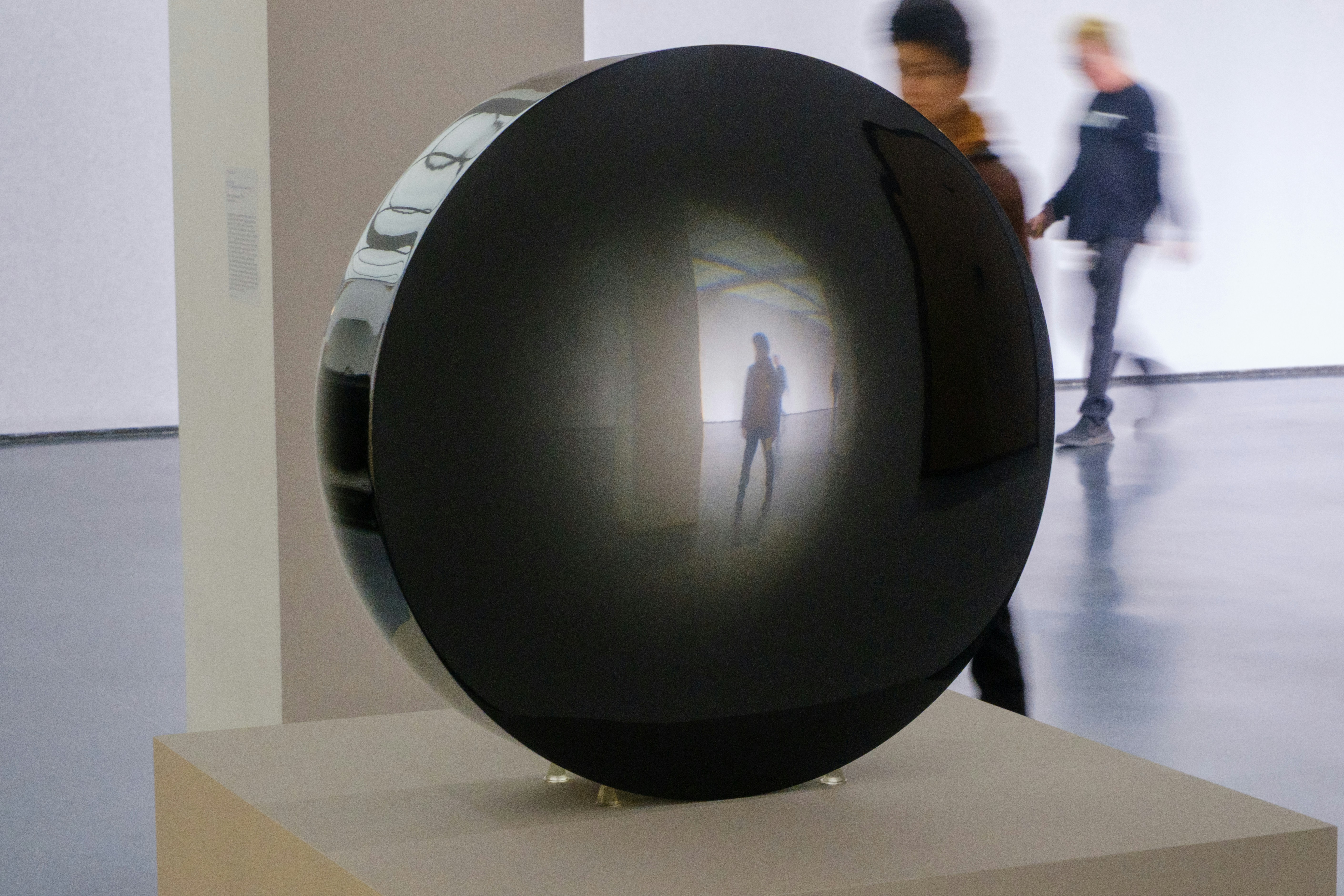Globe of Silence: A Reflective Sphere in a Contemporary Gallery