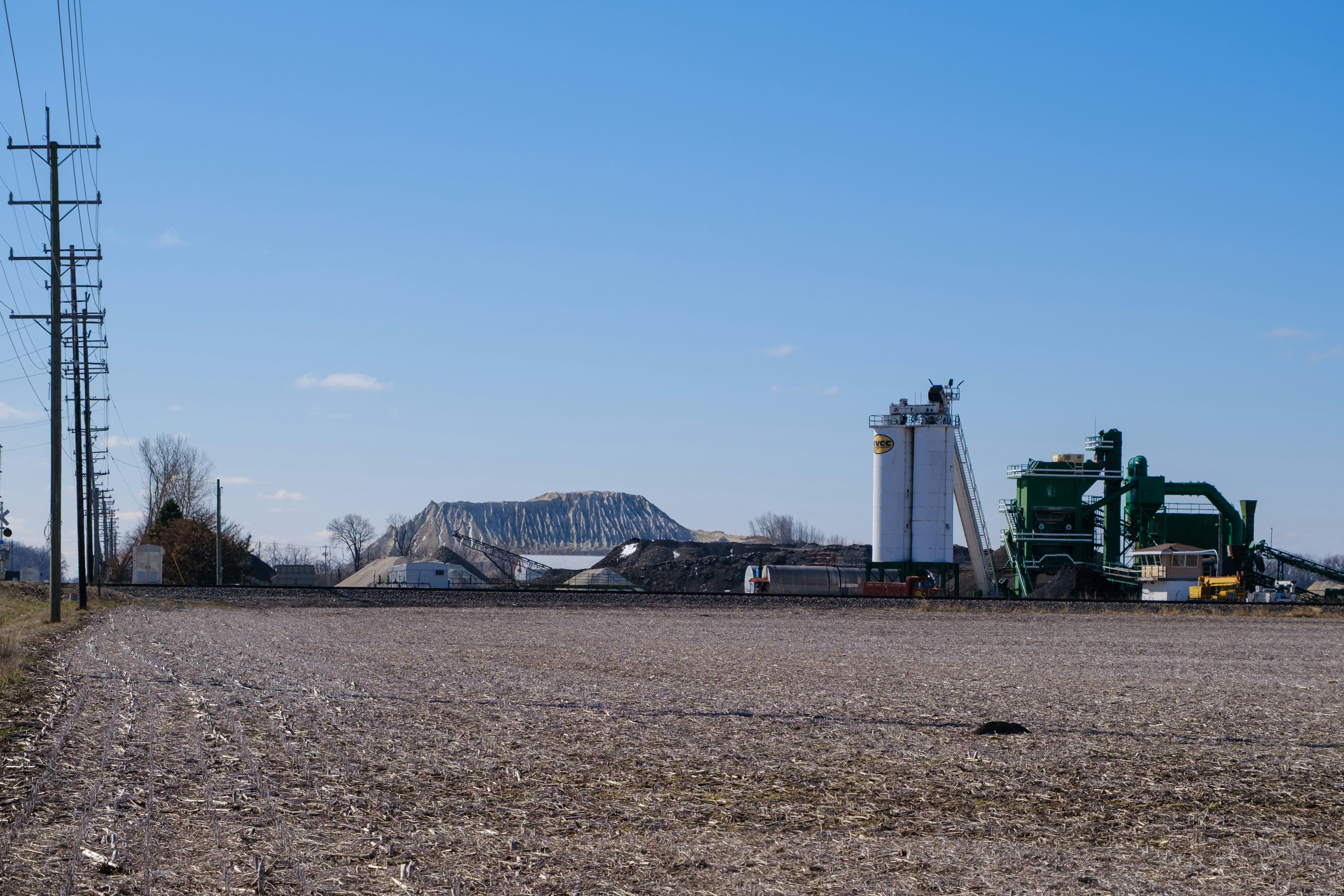 Quiet Quarry Horizon: Industrial Machinery at Distant Rim