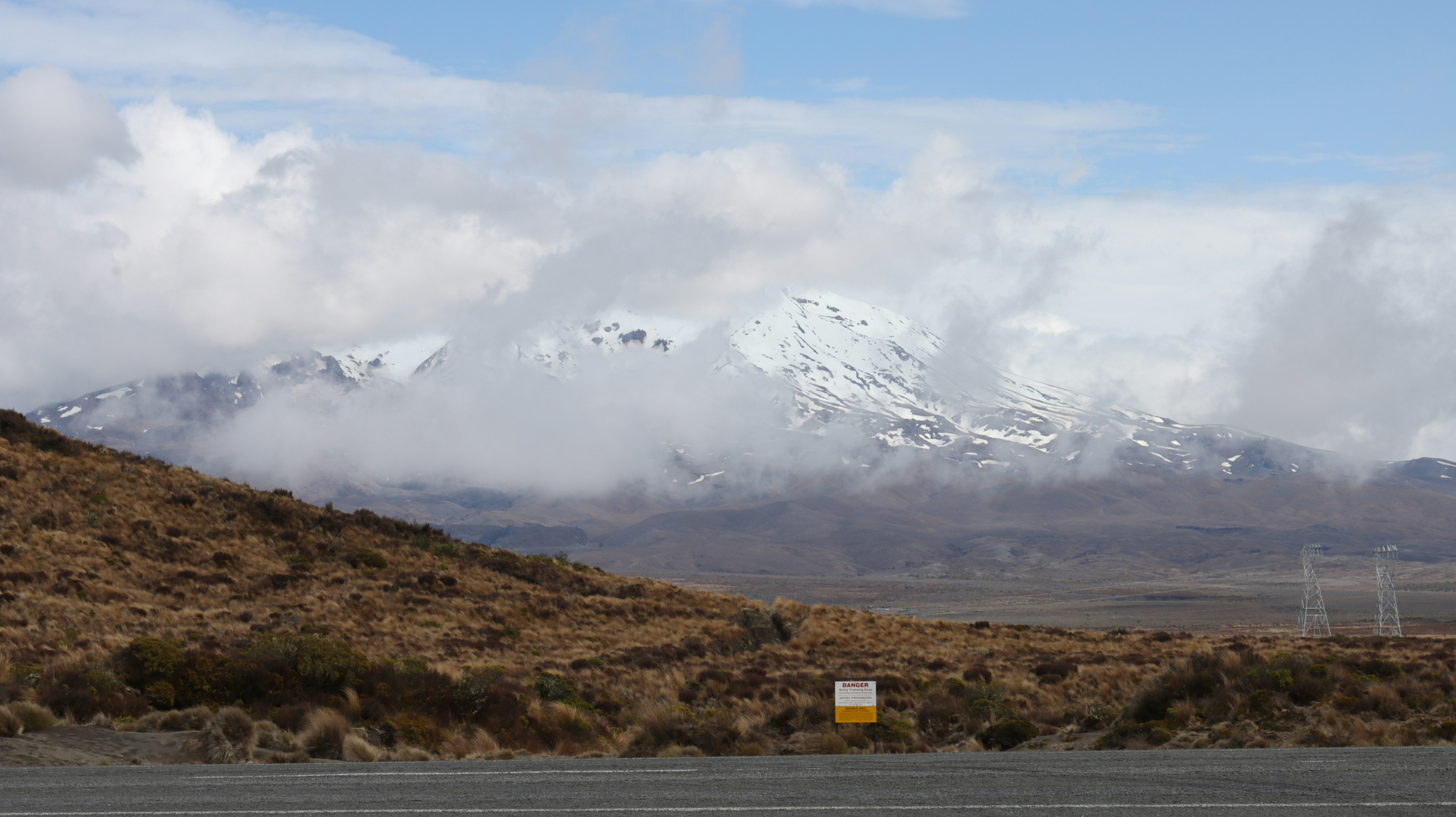 Snow-Capped Ridge Beyond a Wind-Swept Plateau