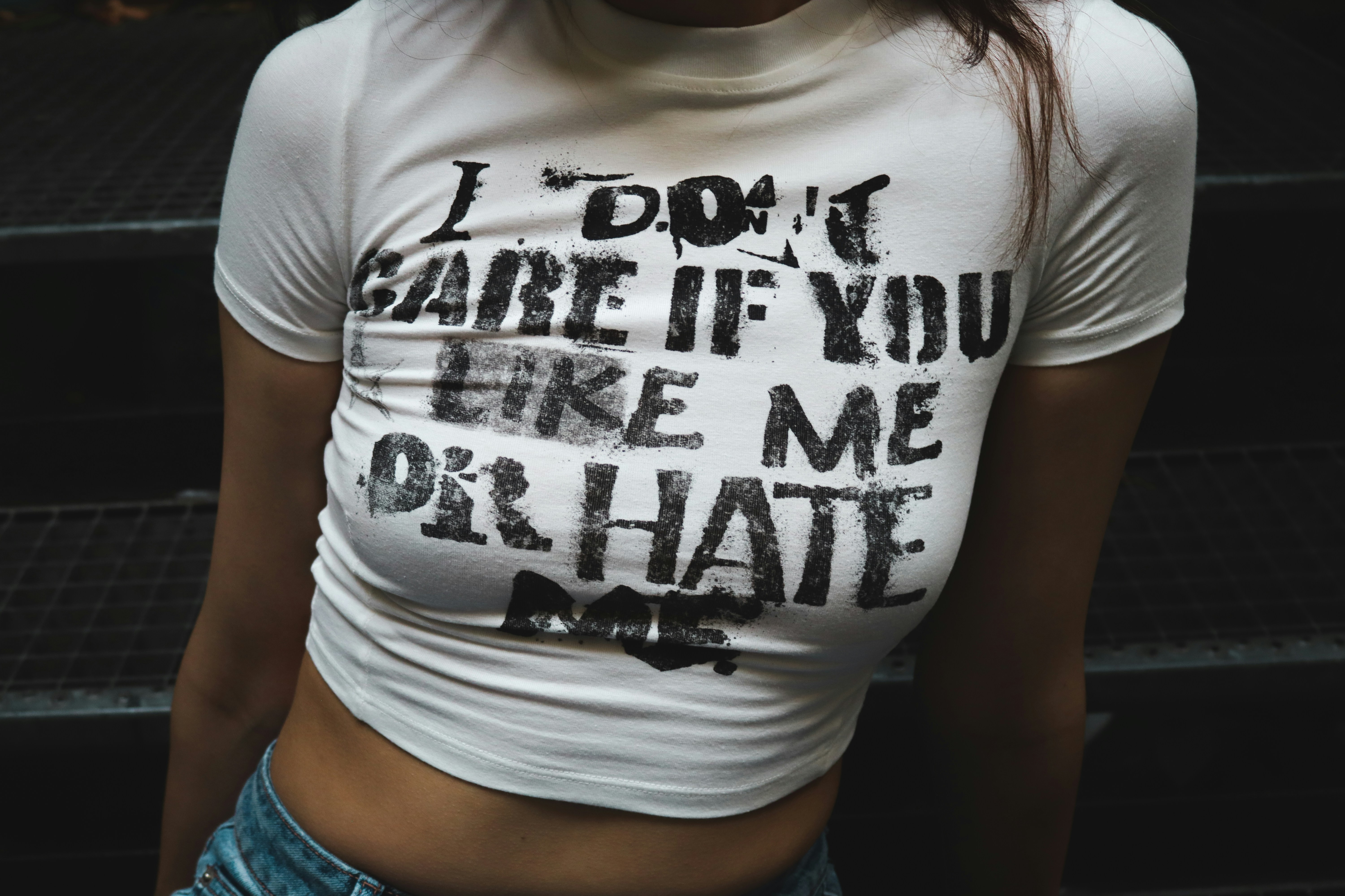 Bold Graphic Tee with Shredded Message in Street-Style Portrait