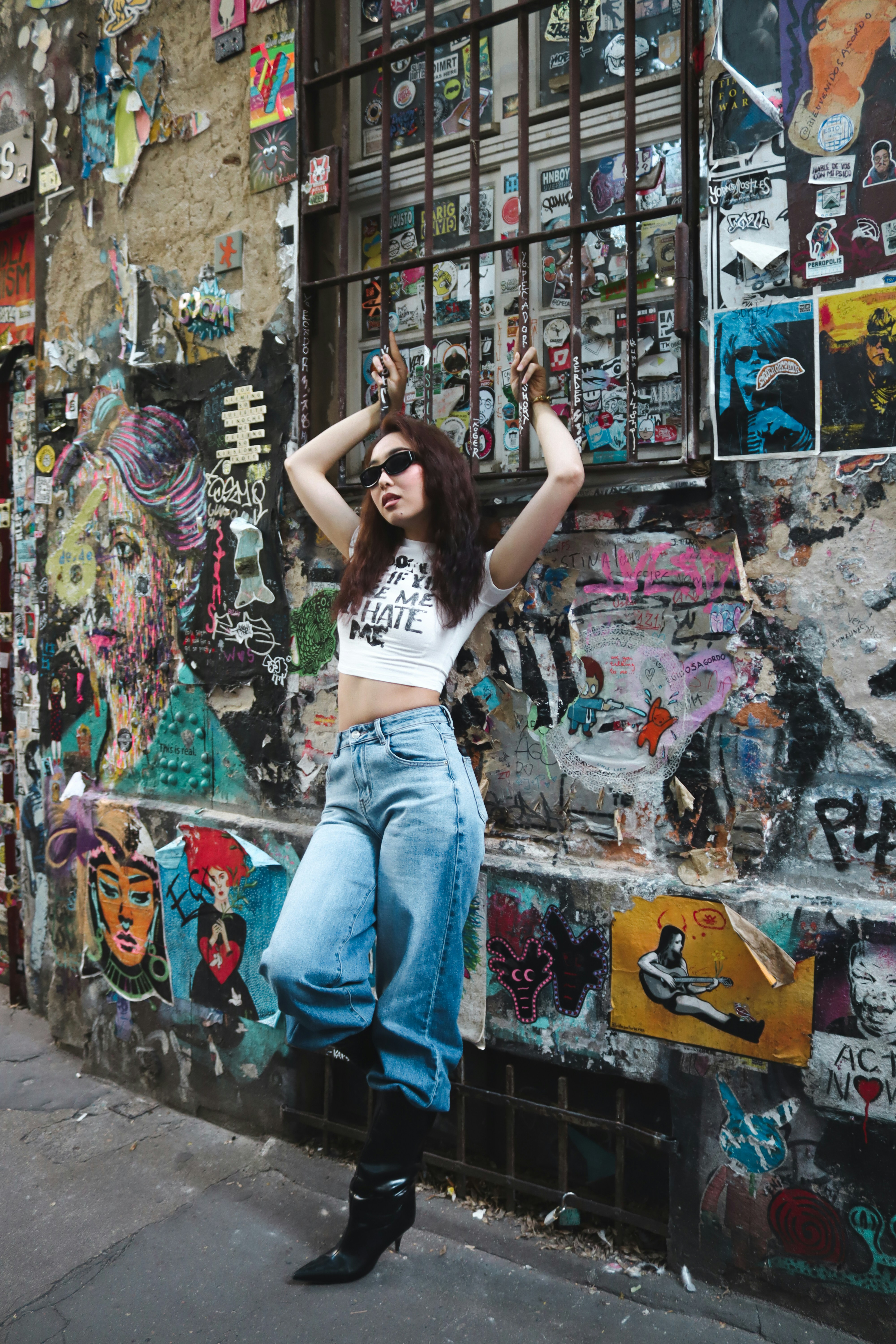 Urban Pose: Jeans, Boots, and Graffiti Glow