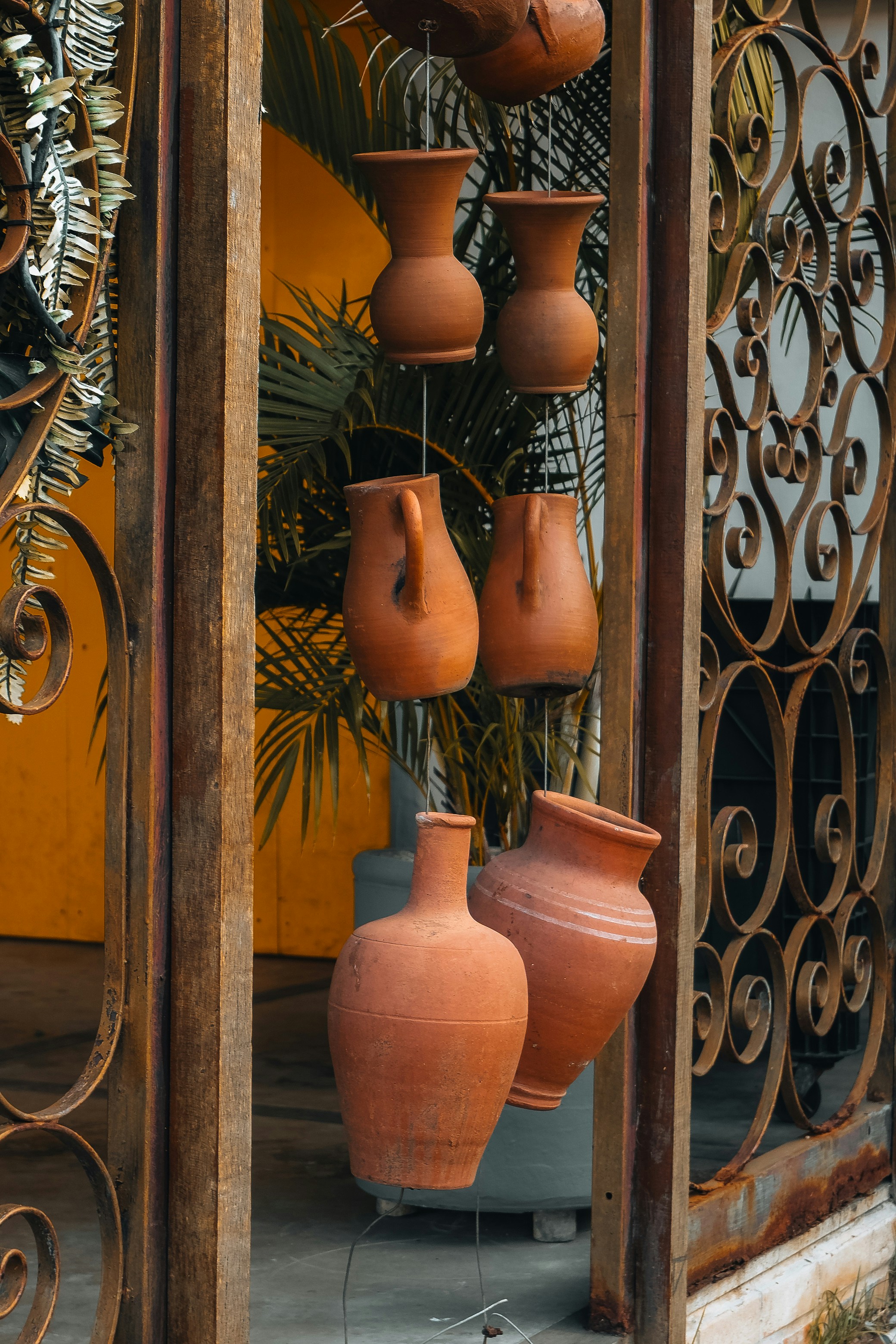 Hanging Terracotta Orbs: A Corridor of Clay Vessels