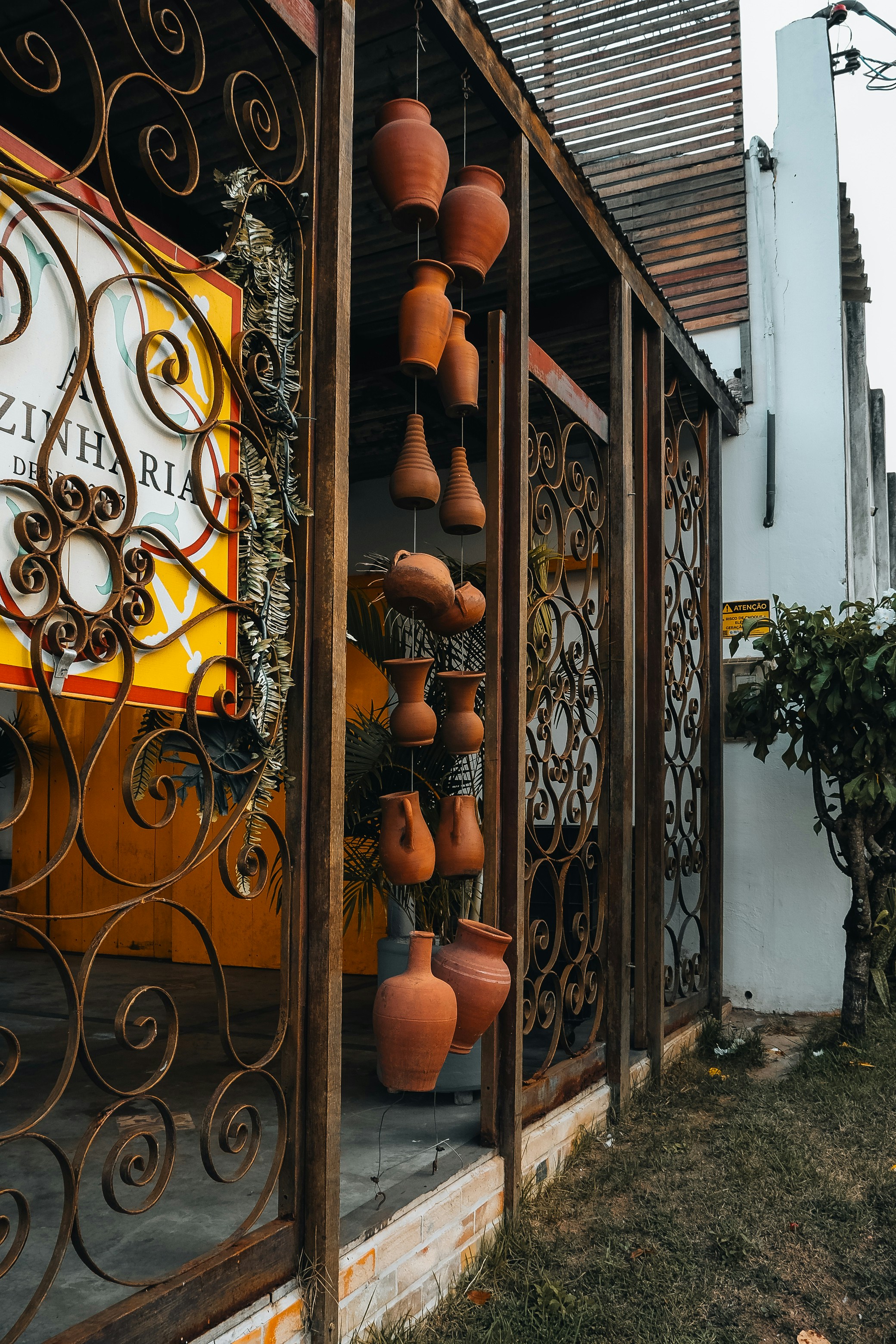 Terracotta Ornaments Framed by Wrought Iron Whorls