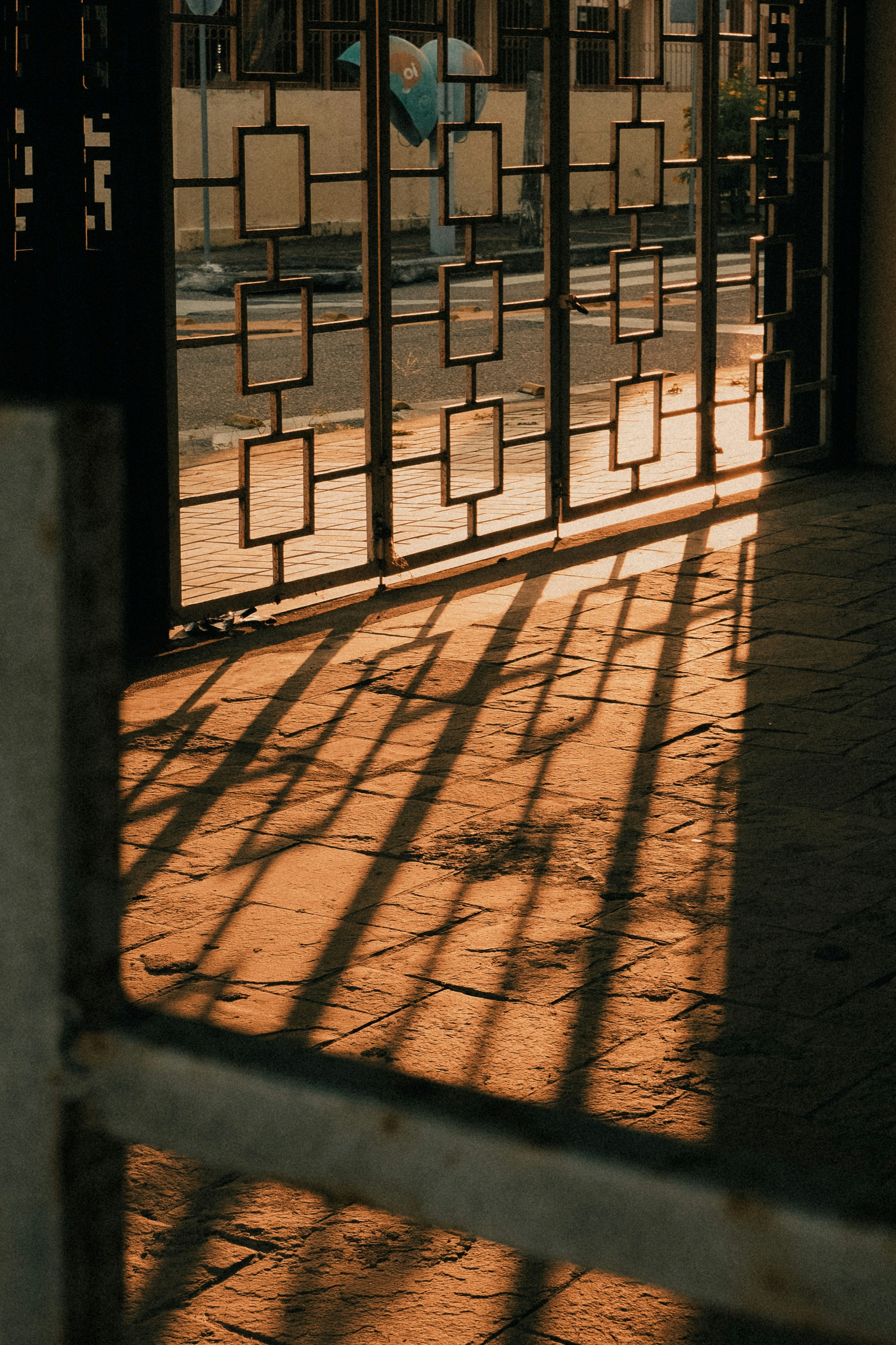 Shadowed Gateways: Sunset Light Casting Geometric Stripes