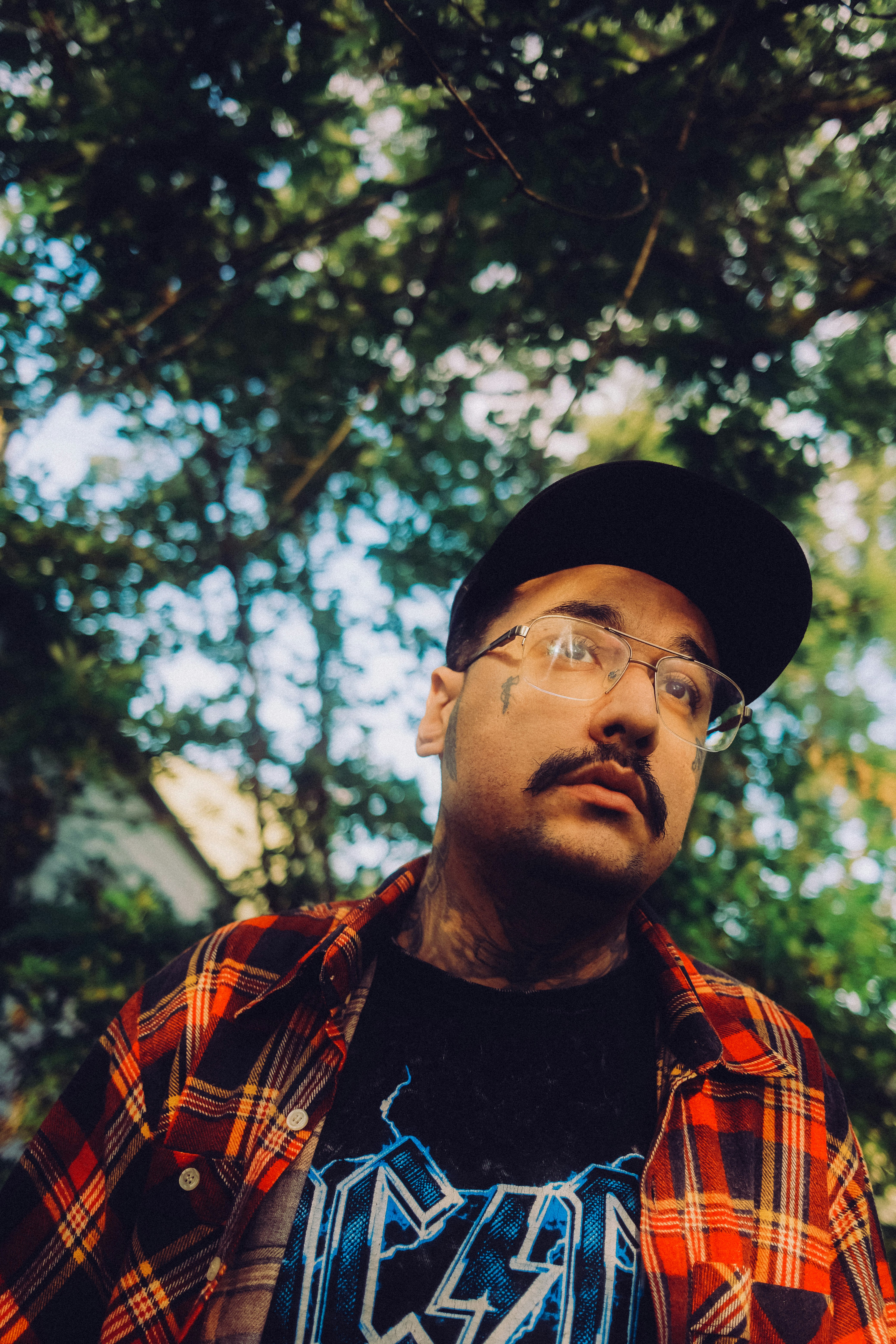 Under the Canopy: A Pocket Portrait in Plaid and Glass