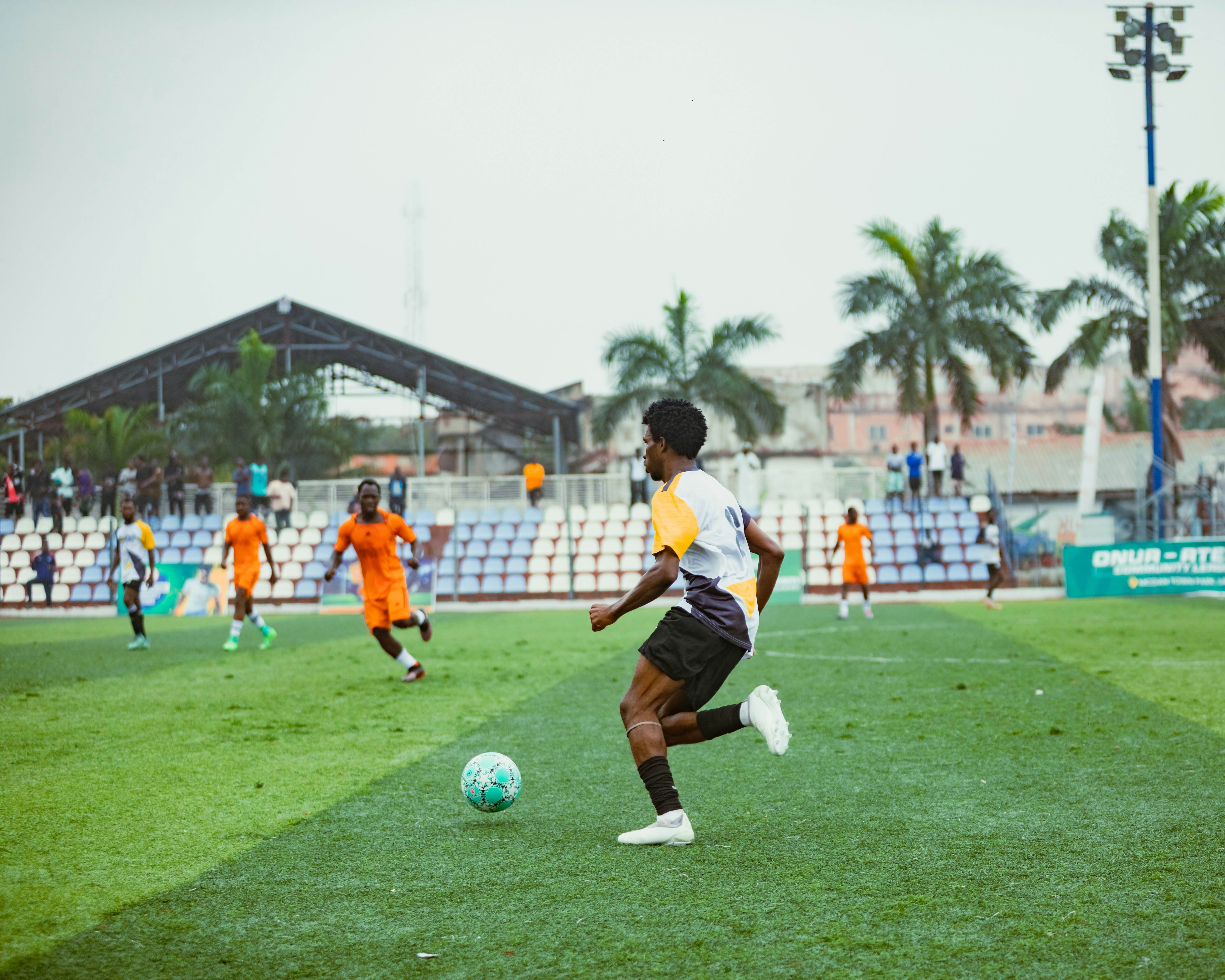 Forward Sprint: The Striker Drives Toward the Ball on a Lush Pitch
