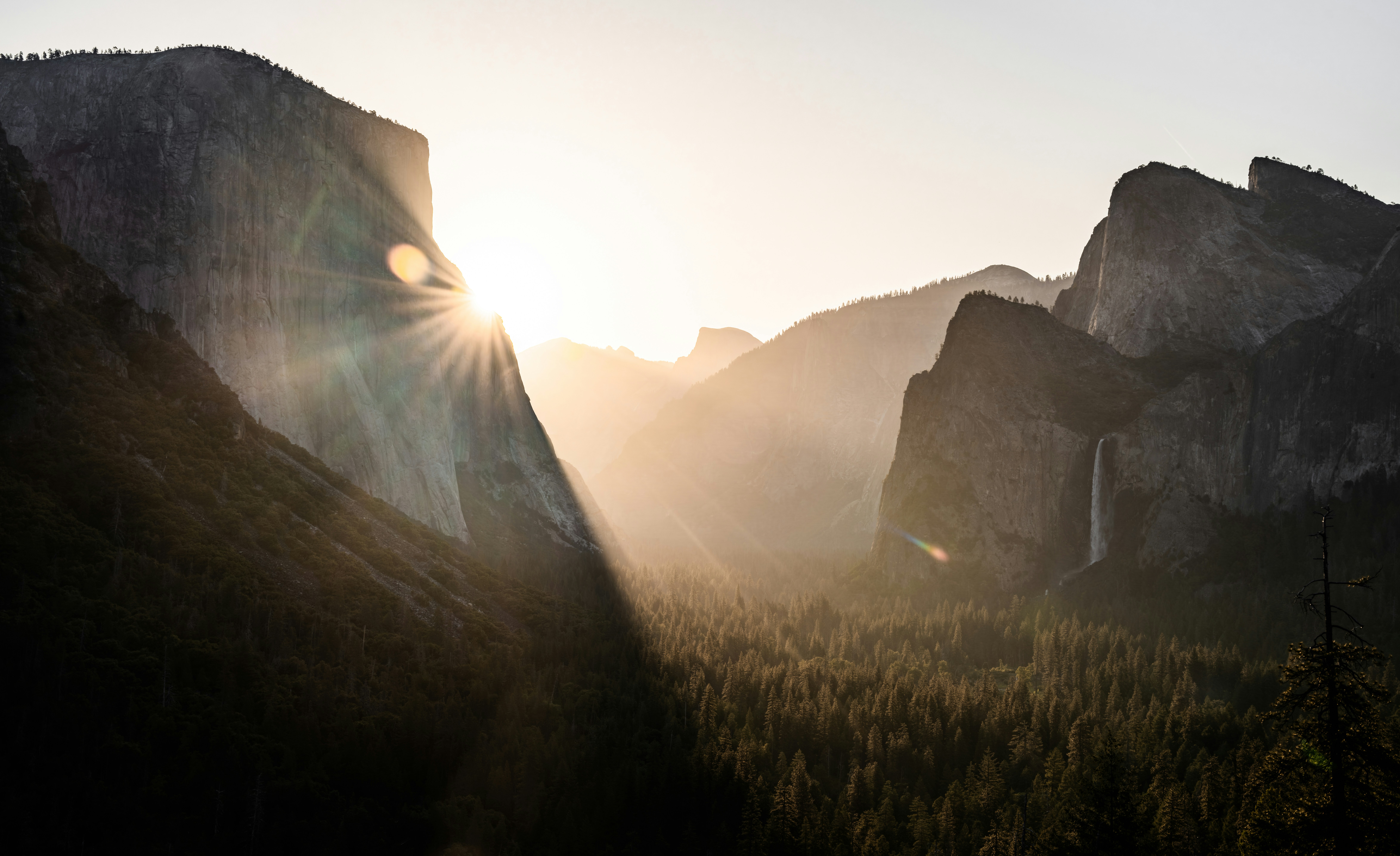 Dawn Faults: Sunlit Valley Between Mountain Giants