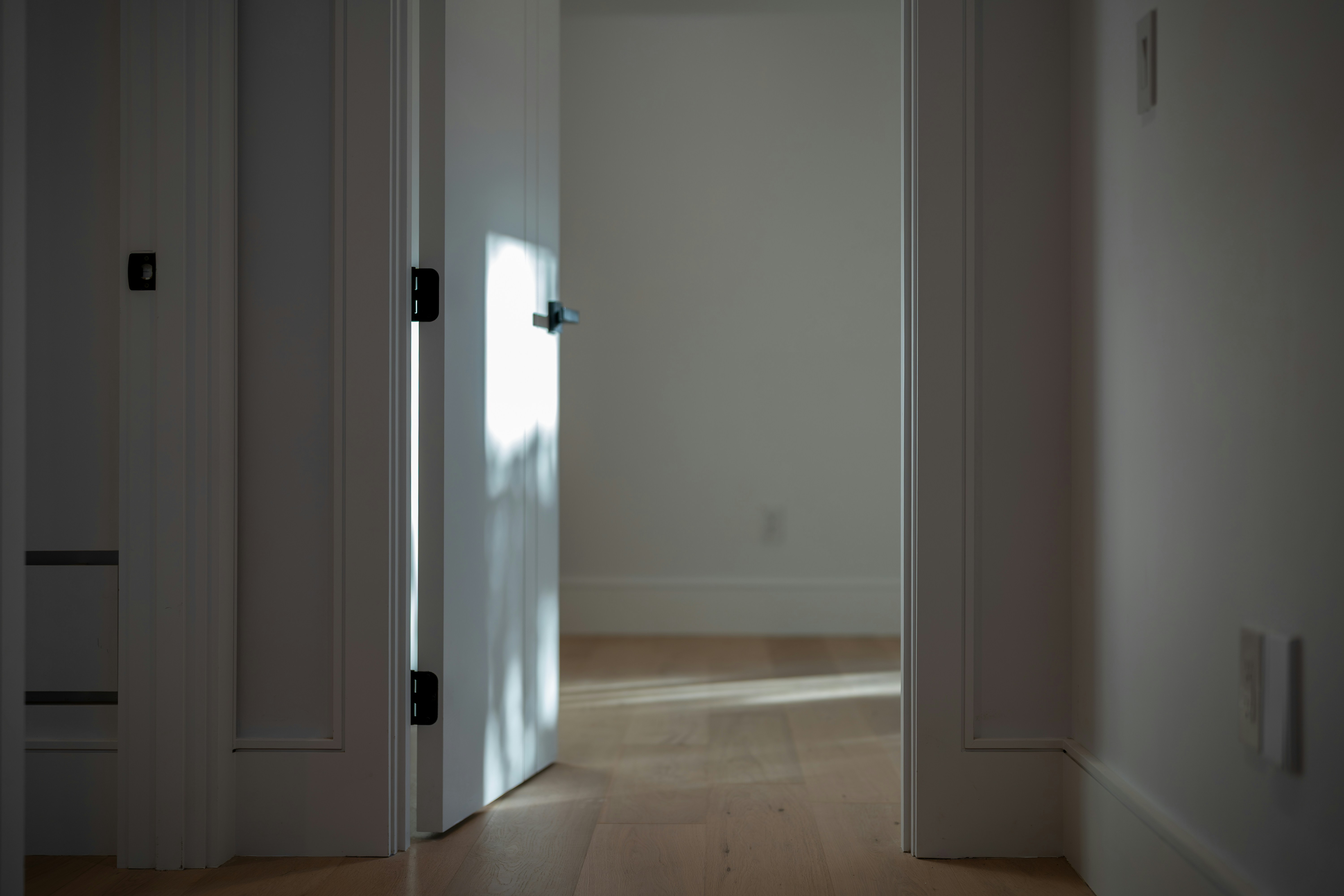 Doorway to Soft Light: A Quiet Hallway Emerges