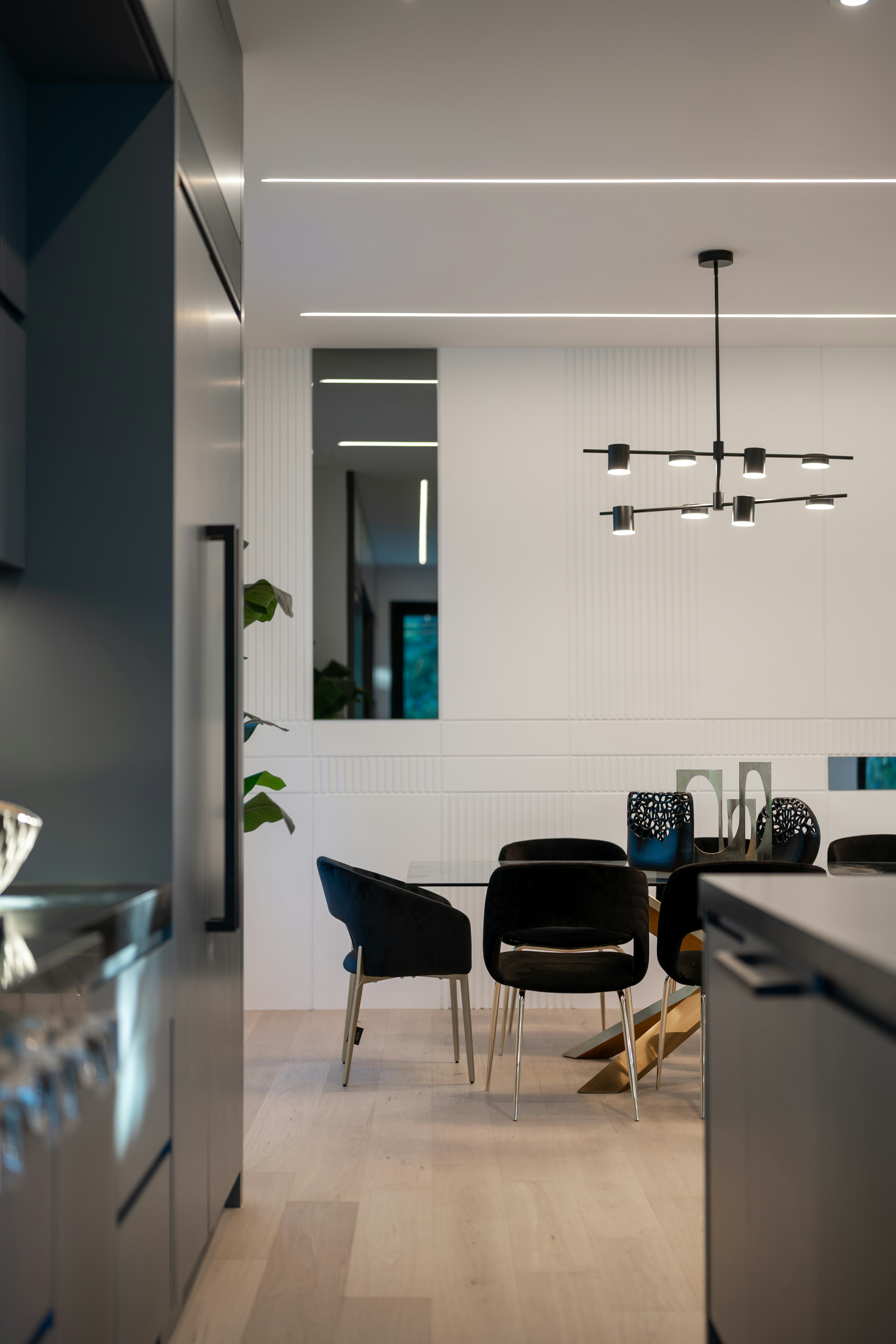 Minimalist Kitchen-Dining Space with Geometric Lighting