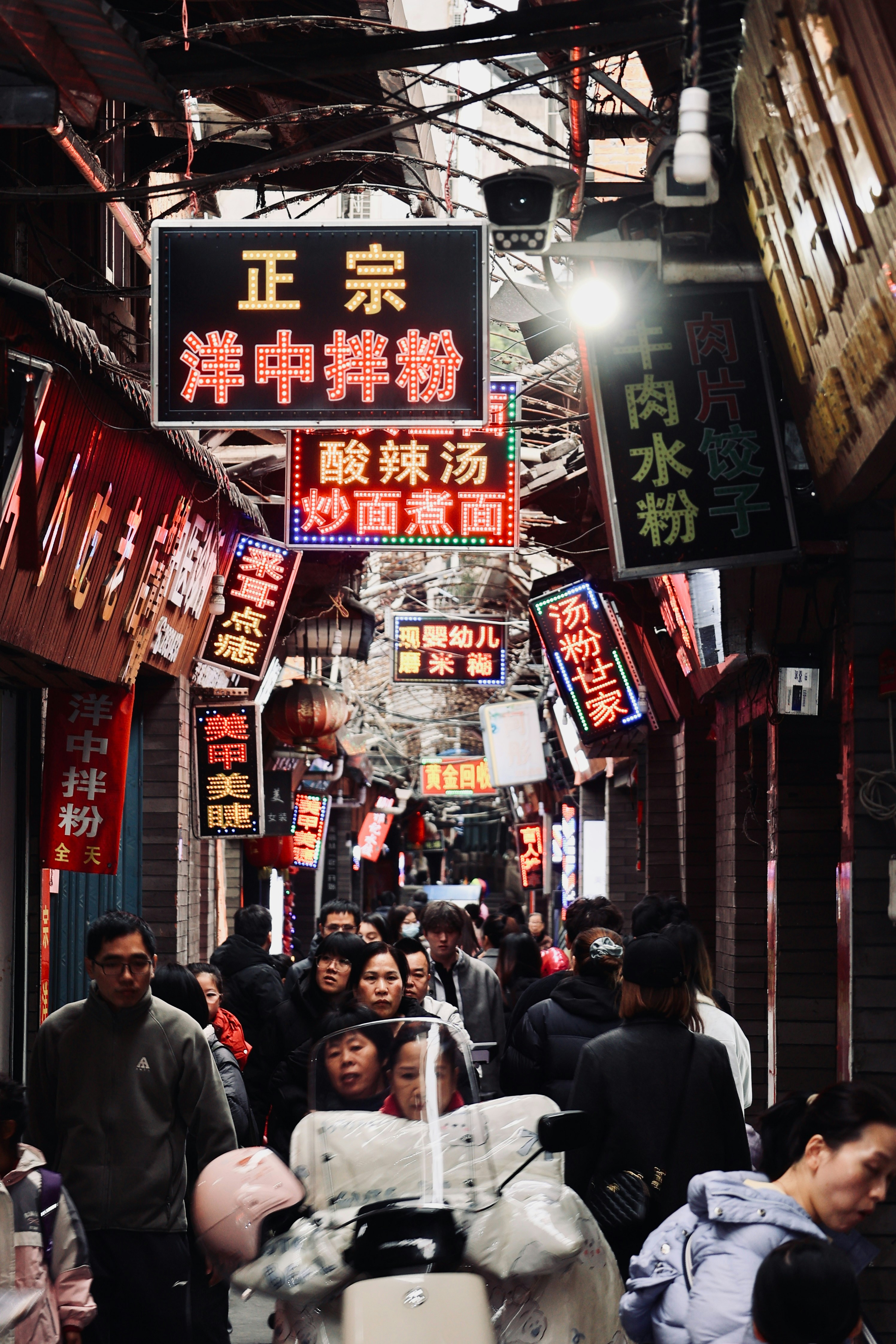 Neon Alley in Pulse: A Crowded Street of Chinese Signboards