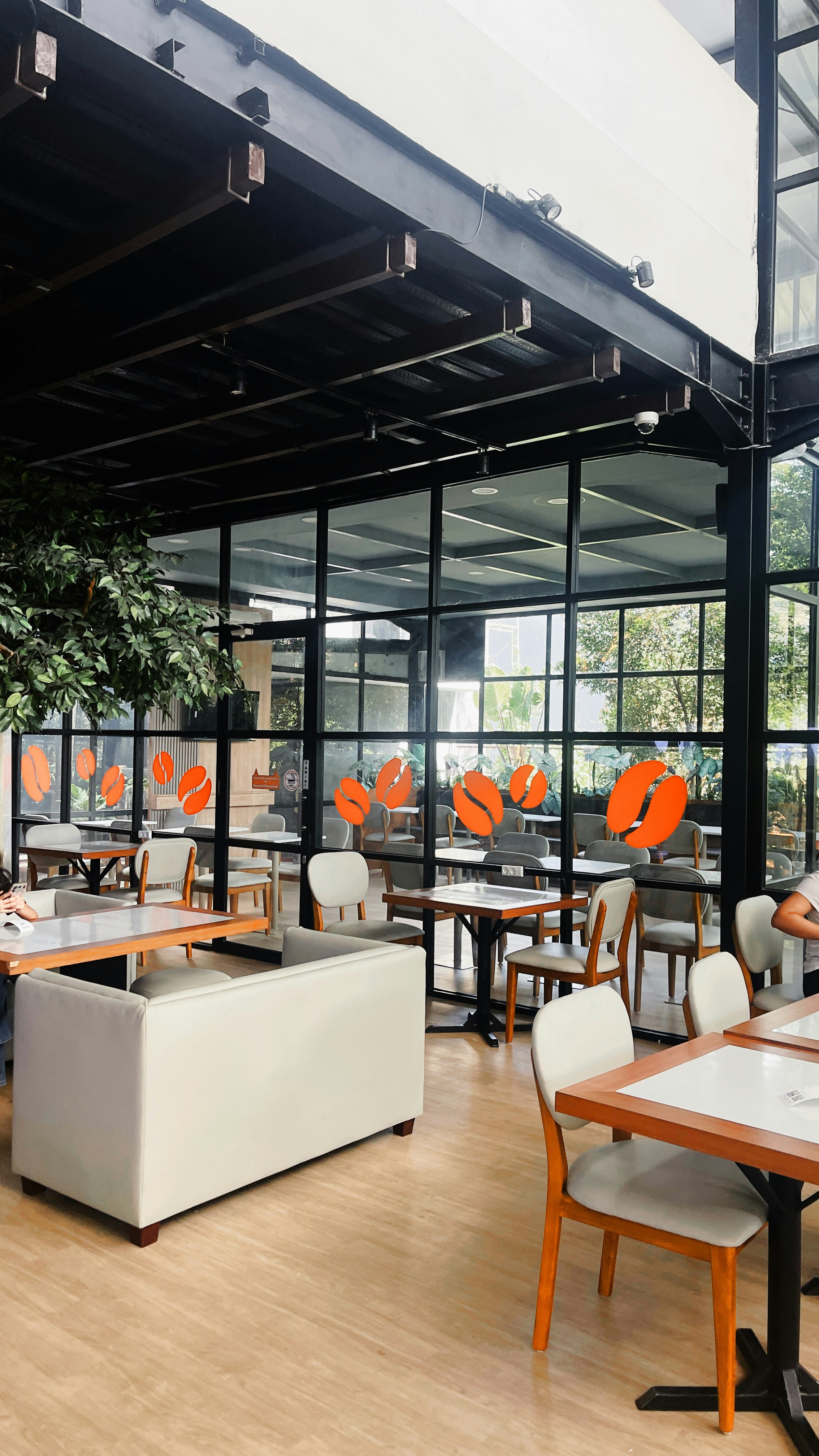 Bright Cafe Atrium with Orange Leaf Accents