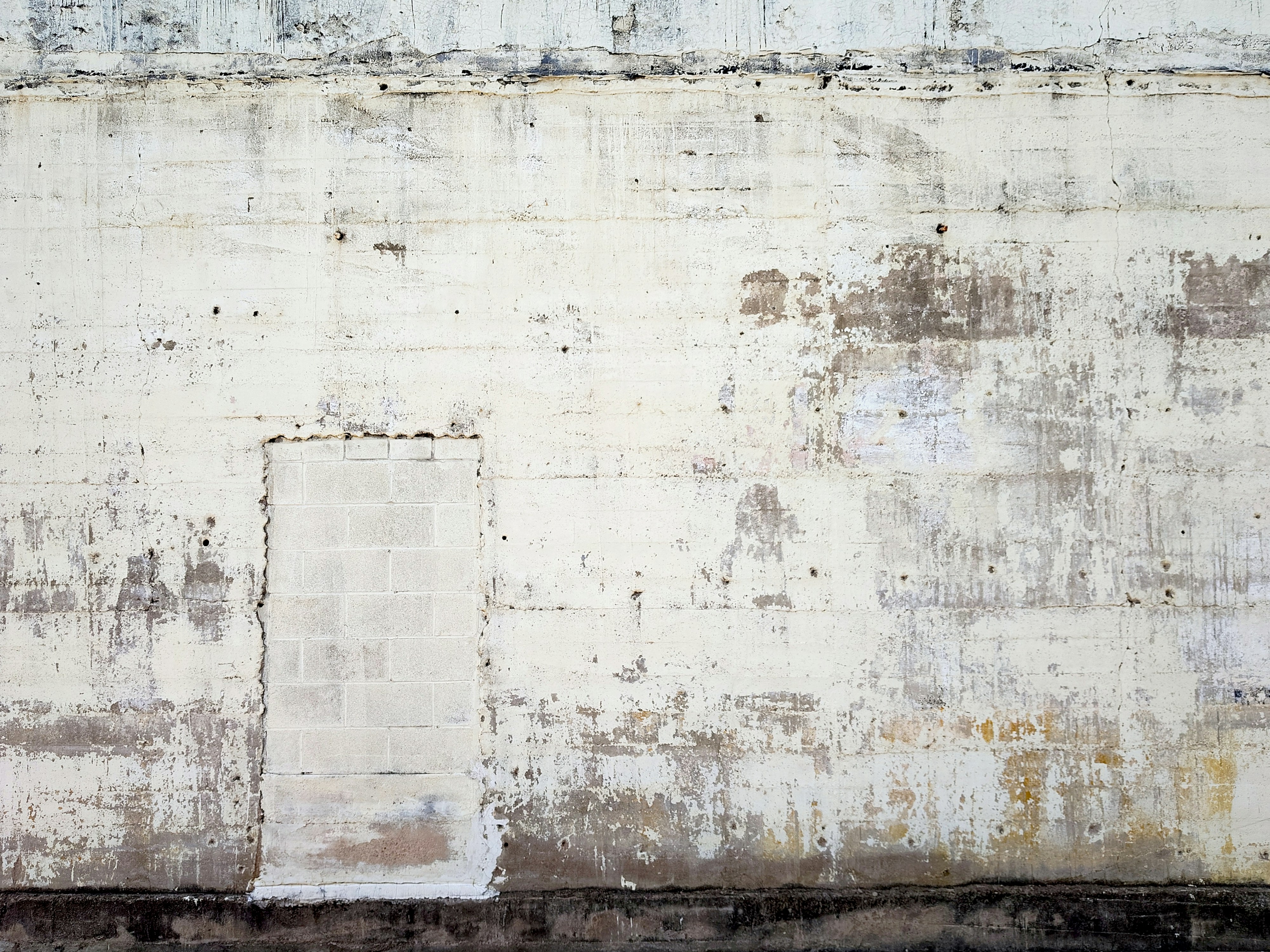 Weathered Wall with Faded Architecture Echoes
