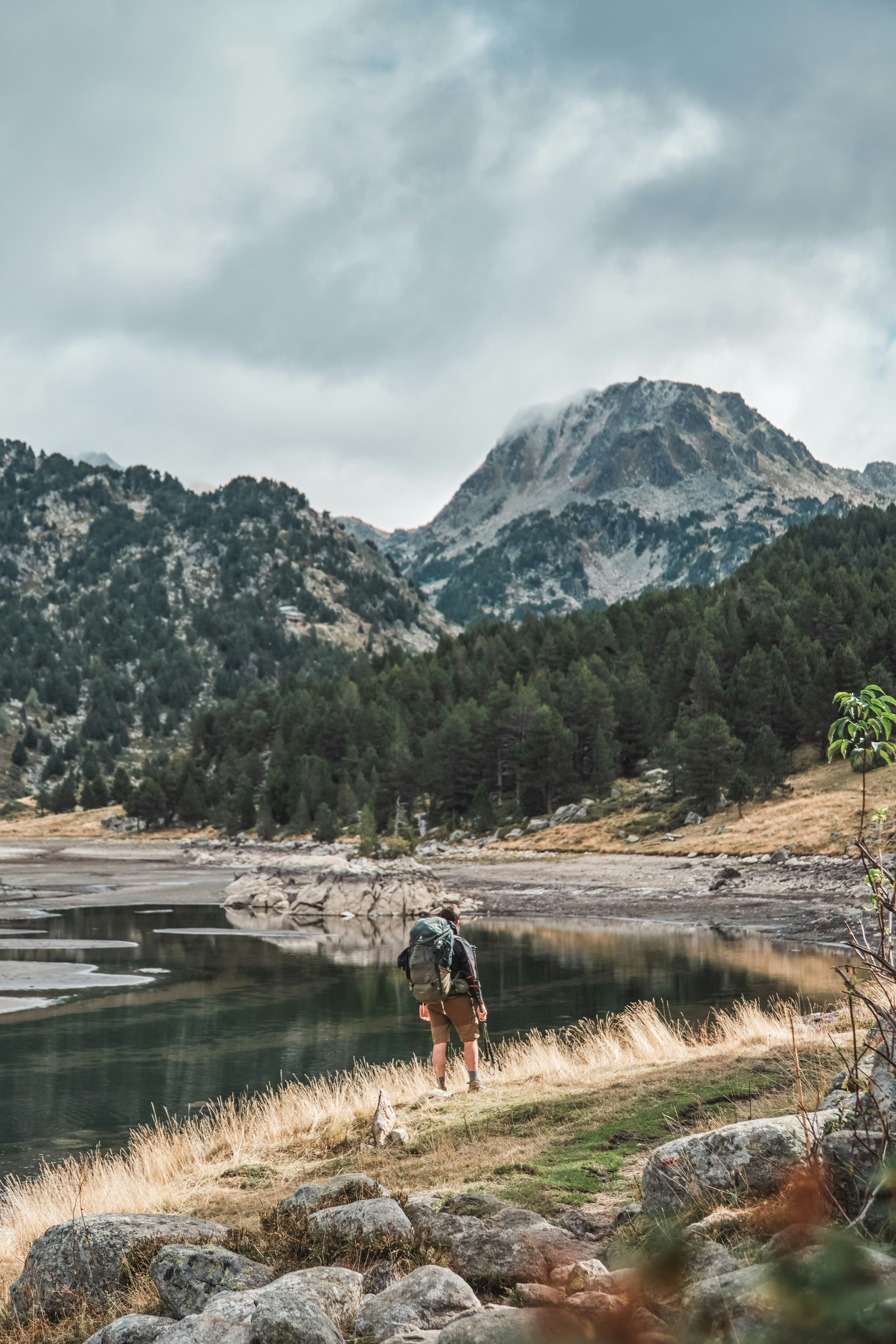 Hiker by a Mountain Lake: Quiet Edge of the Valley