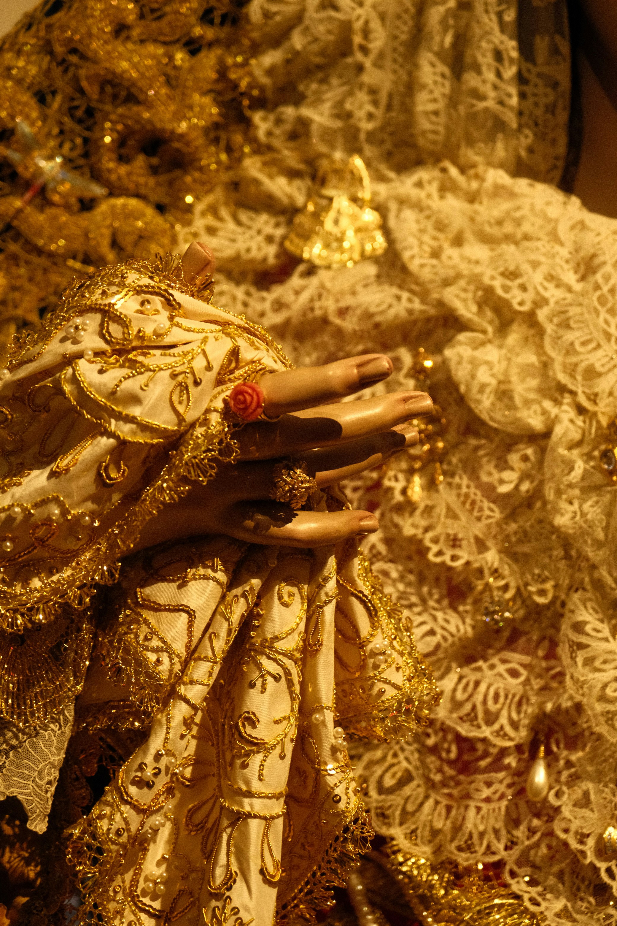 Ornate Hands and Lace: Golden Threads on a Velvet Embrace