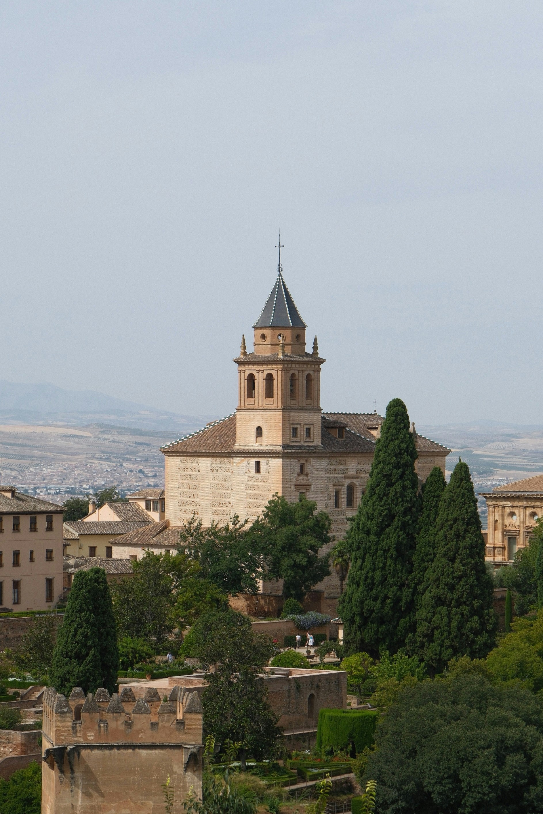 Bell Tower Rising Above Carved Stone and Cedar Gardens