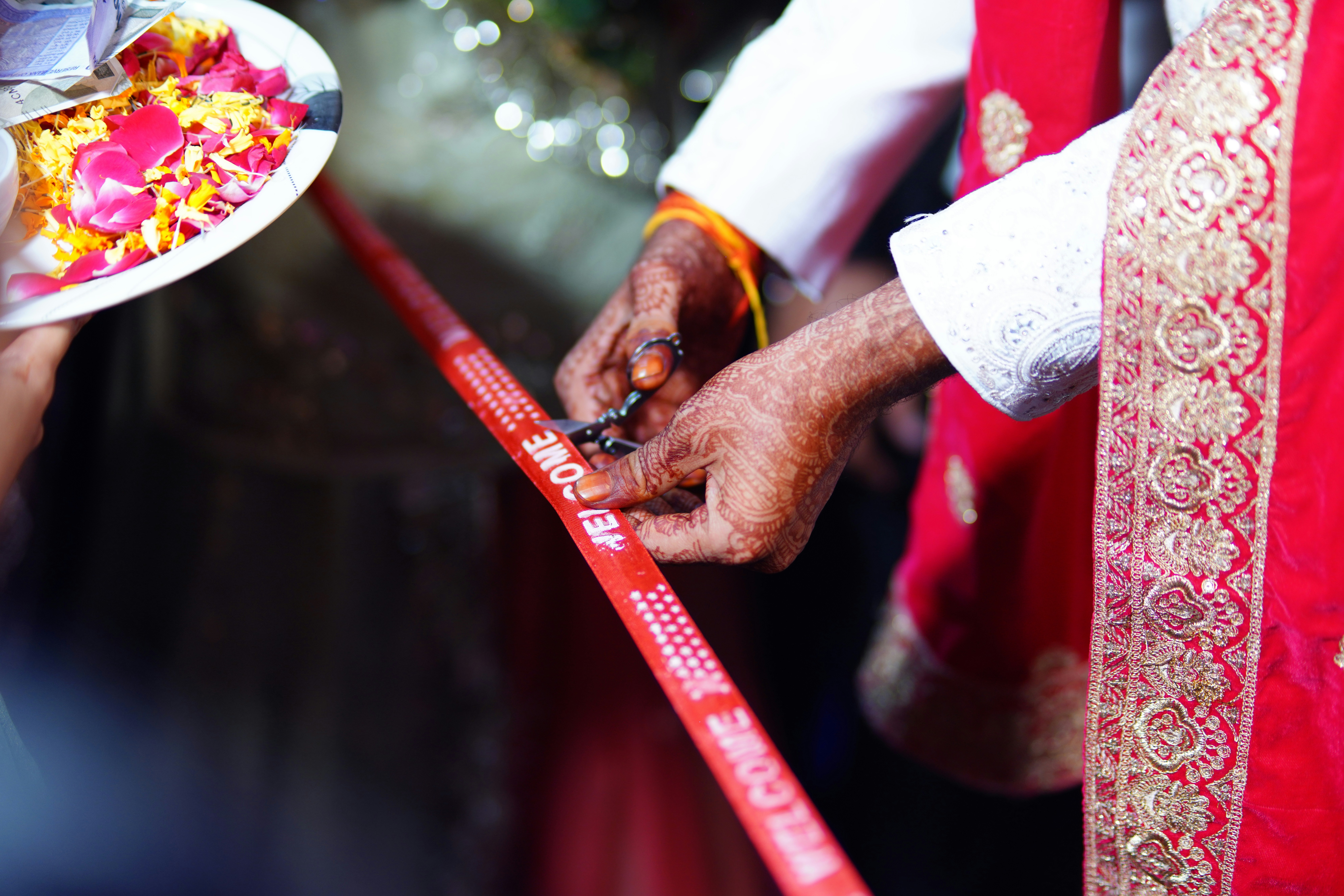 The Red Ribbon of Ceremony: A Hand to Seal a Blessing