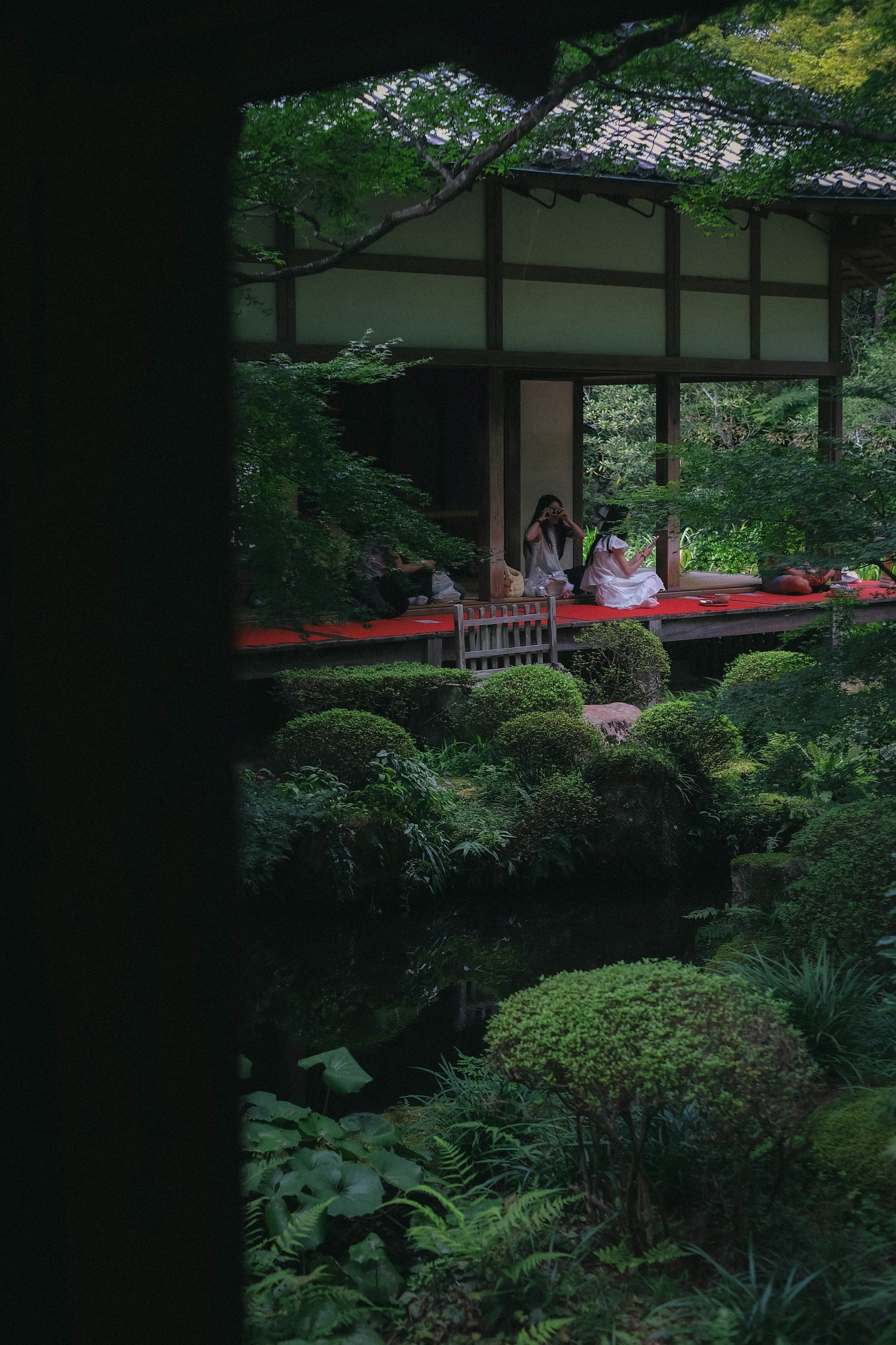 Tea House in Green Retreat: Quiet Moment on a Garden Verge