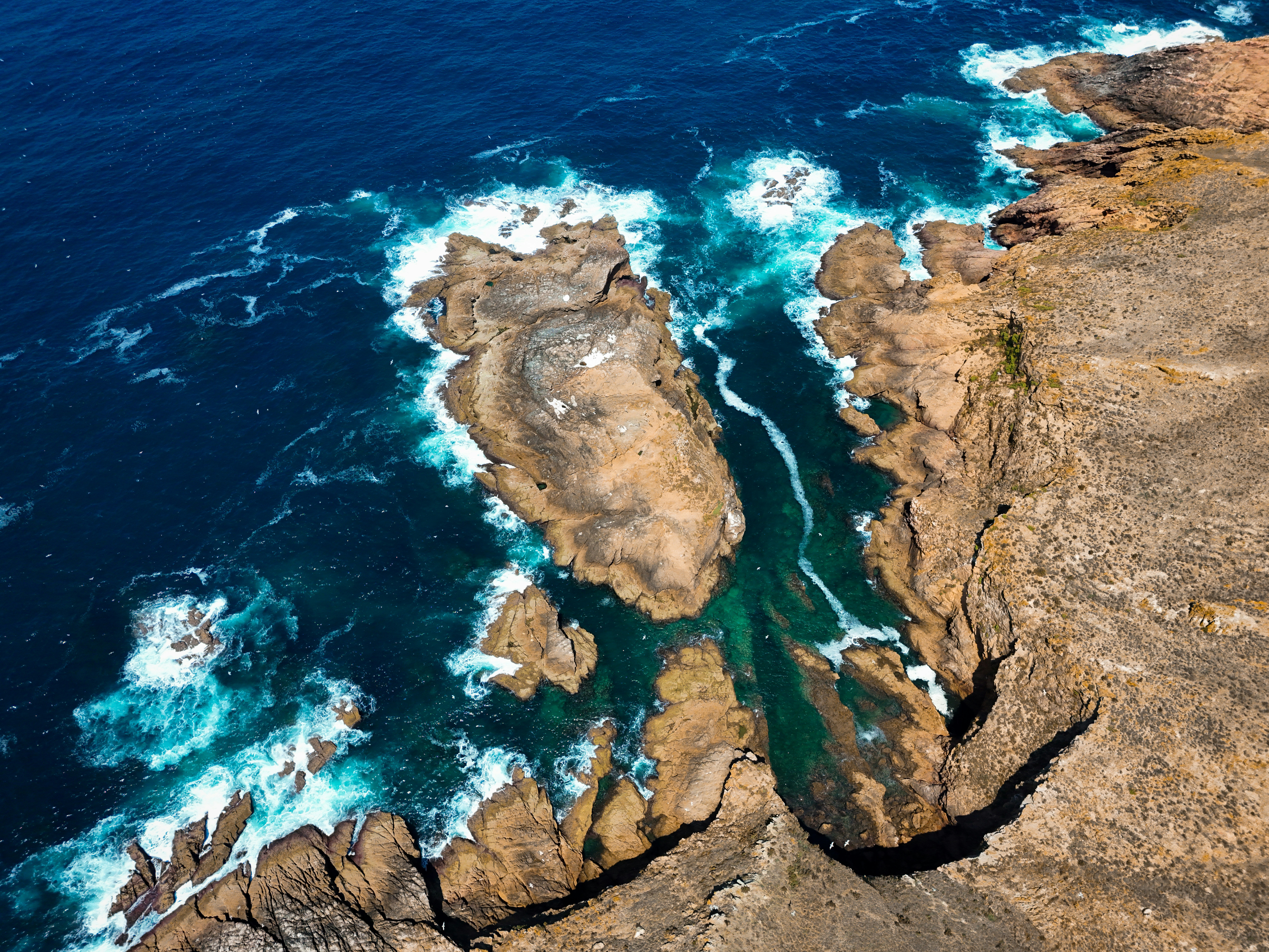 Rugged Atlantic Cliffs Fractured by Azure Tide